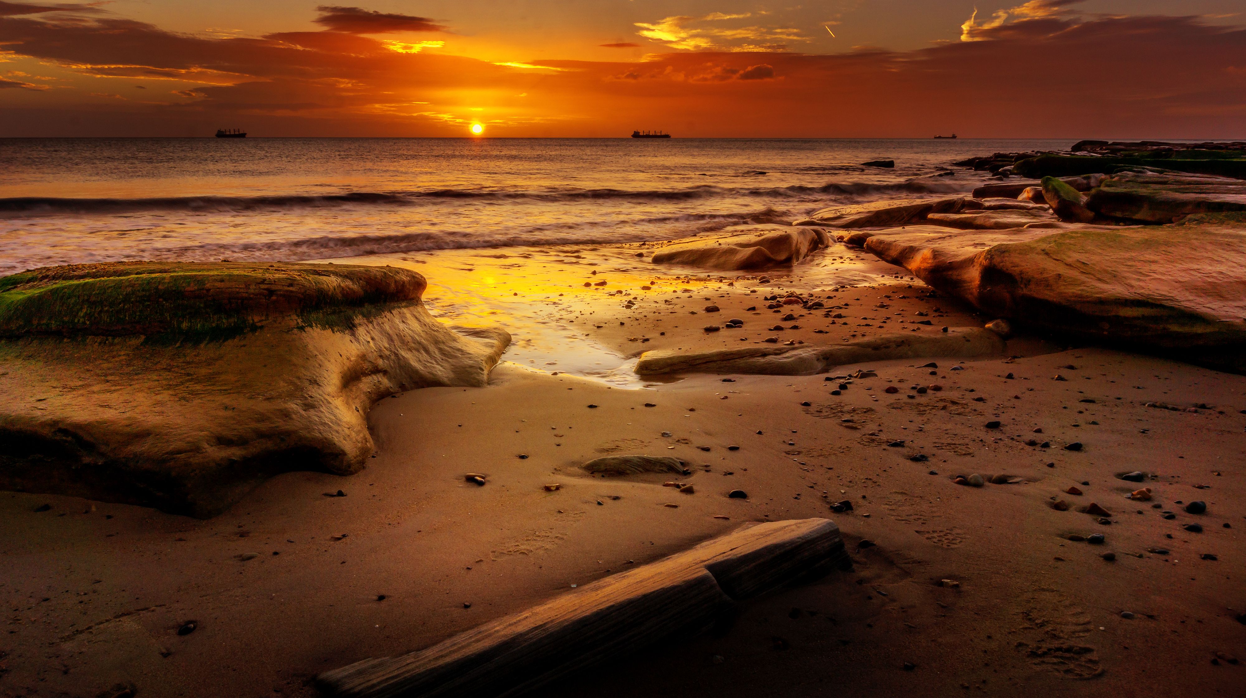 Rocks on Beach on Sea Shore at Sunset · Free Stock Photo