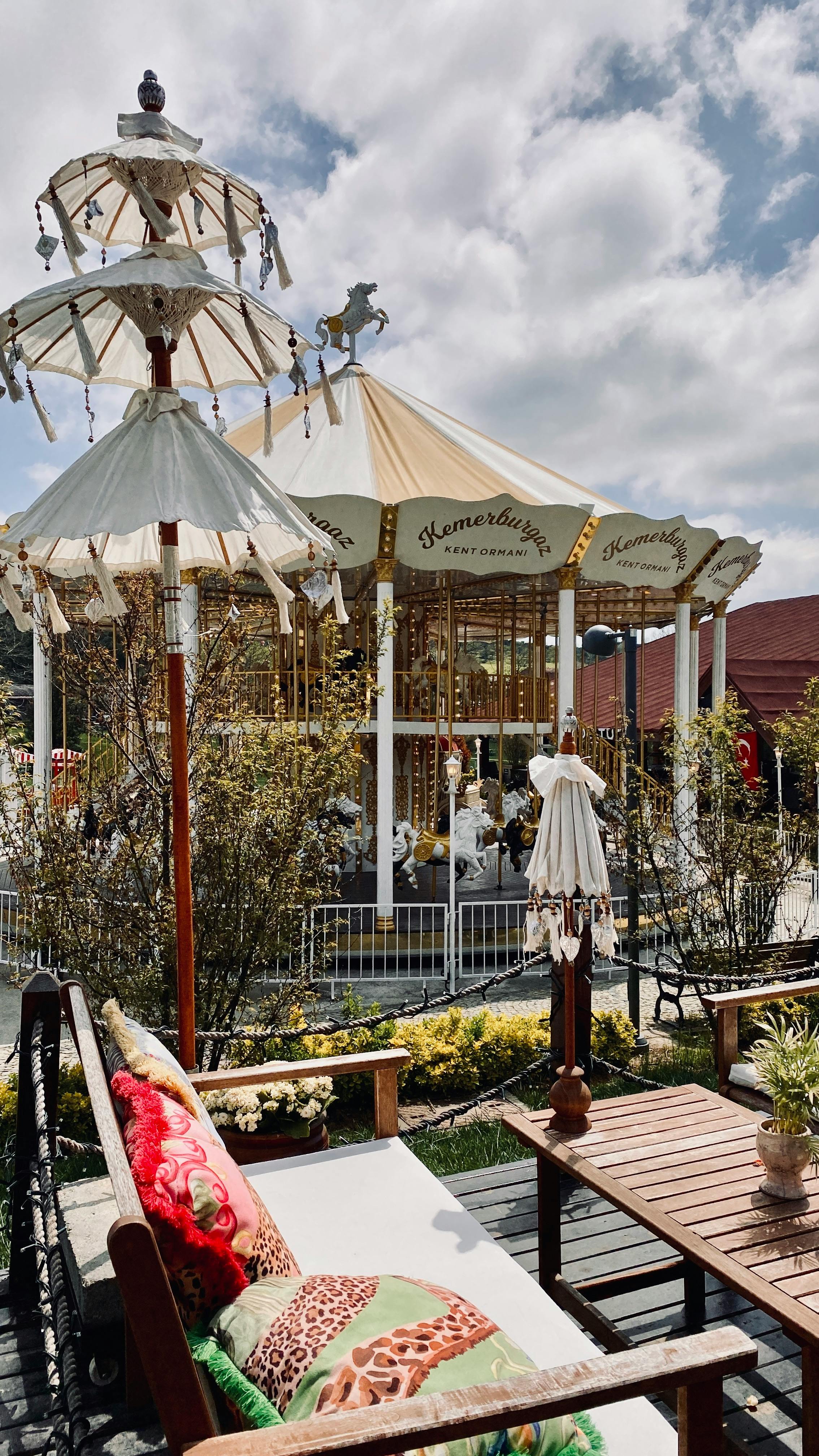 Table and Bench near Carousel at Park · Free Stock Photo