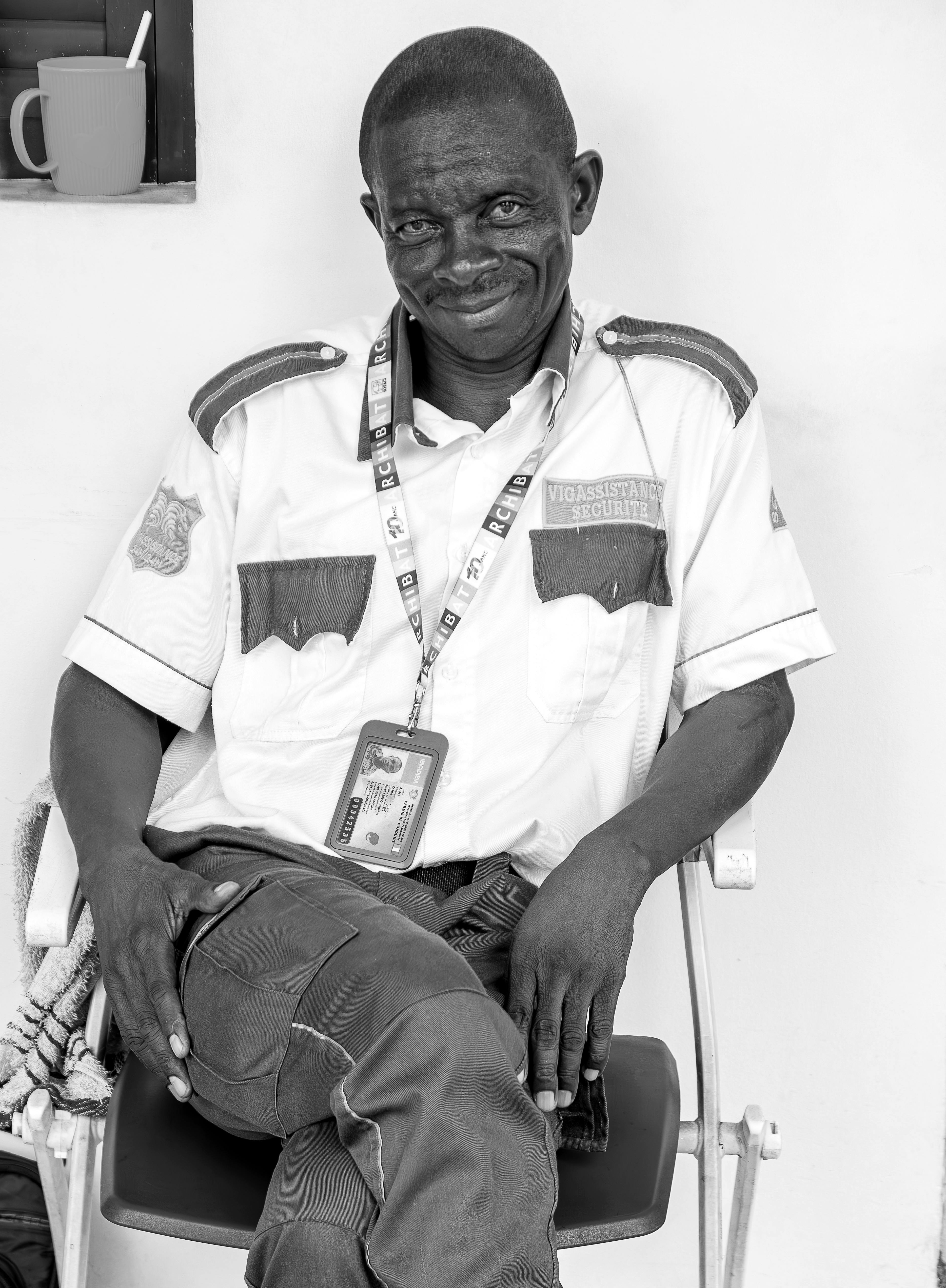 Smiling Man in Shirt of Security Guard · Free Stock Photo