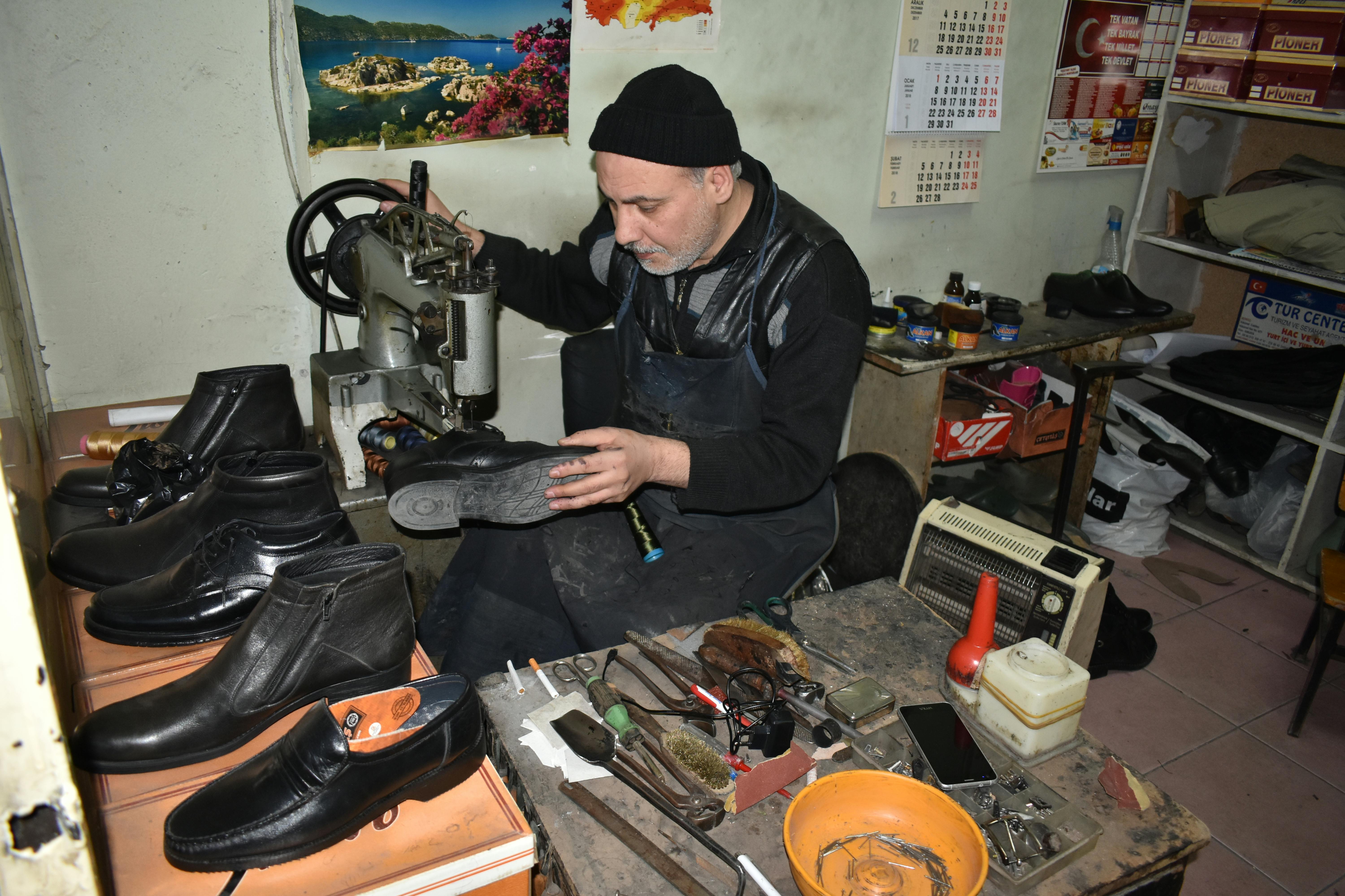 Shoemaker Sitting and Working in Workshop · Free Stock Photo
