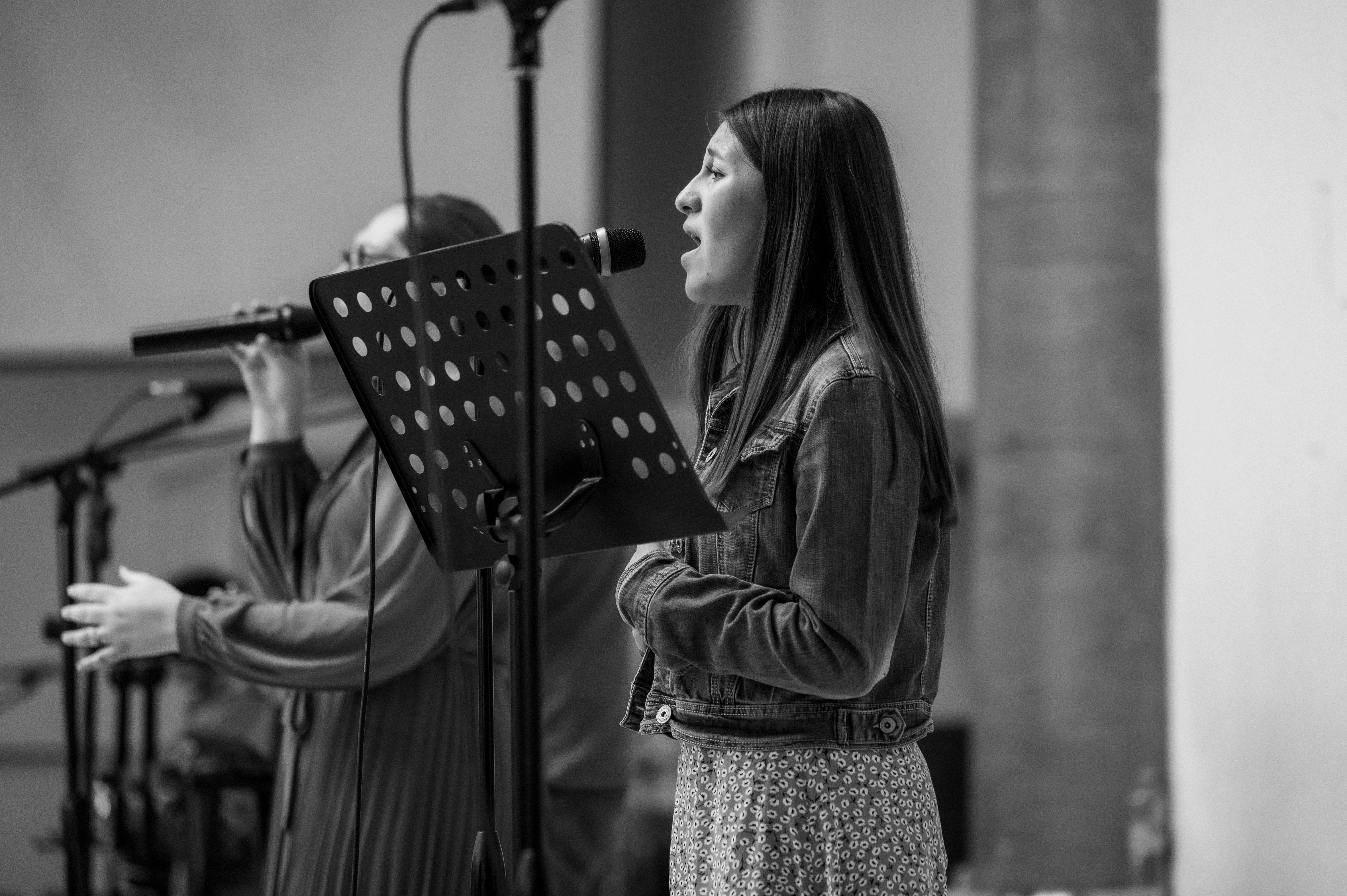 Woman Standing and Singing at Concert · Free Stock Photo