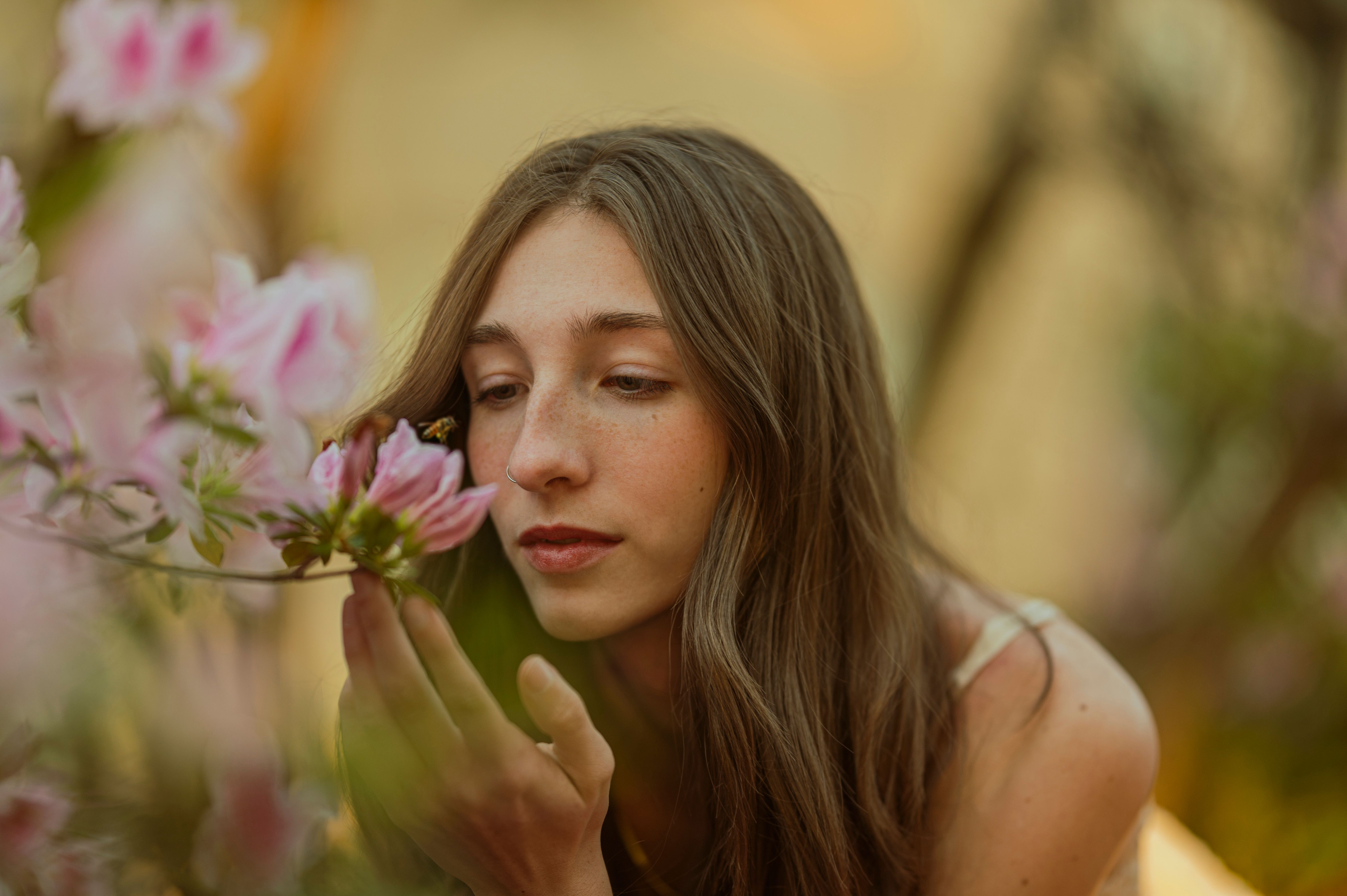 Woman Smelling Pink Flowers · Free Stock Photo