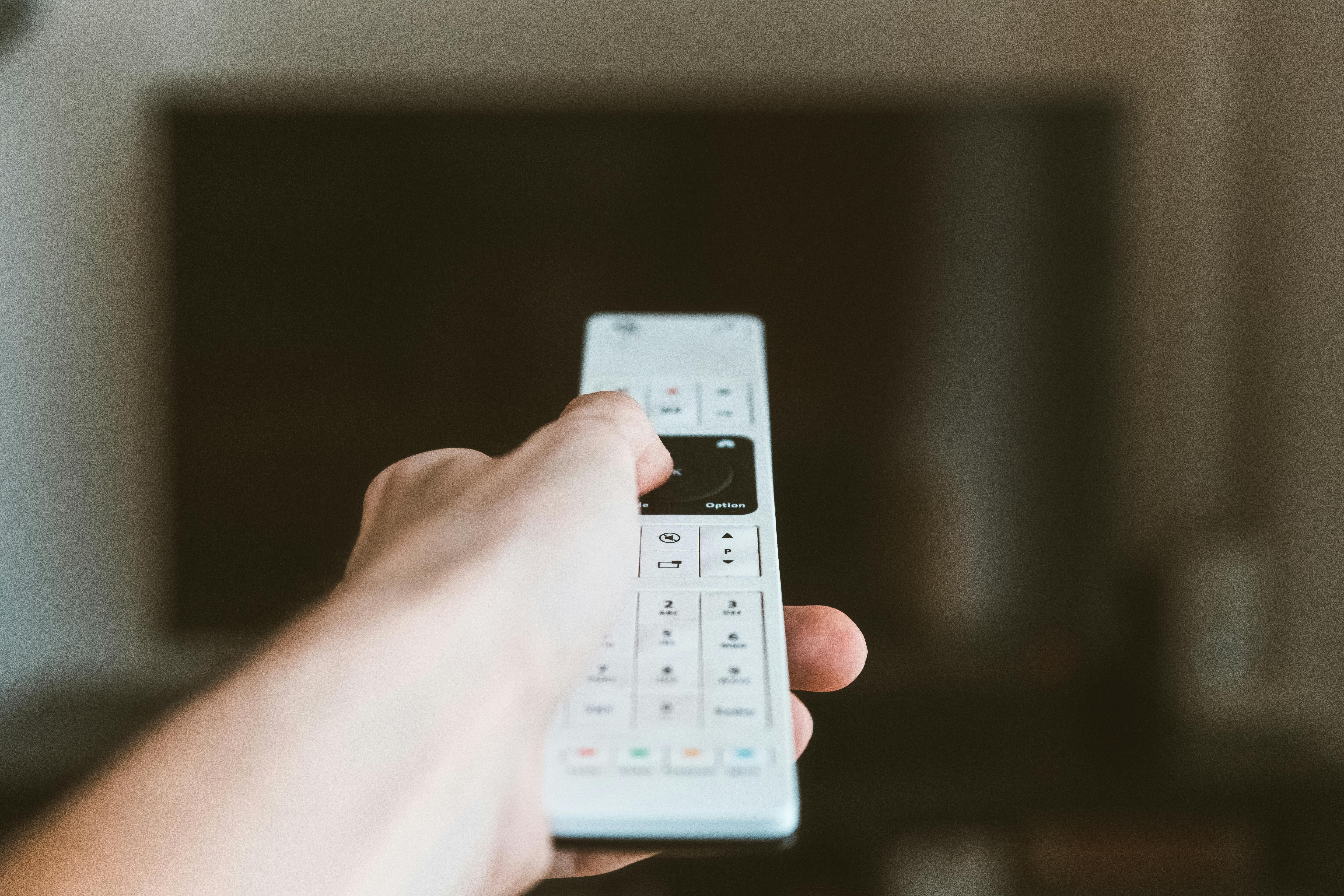 Changing TV channels with the Remote Control · Free Stock Photo