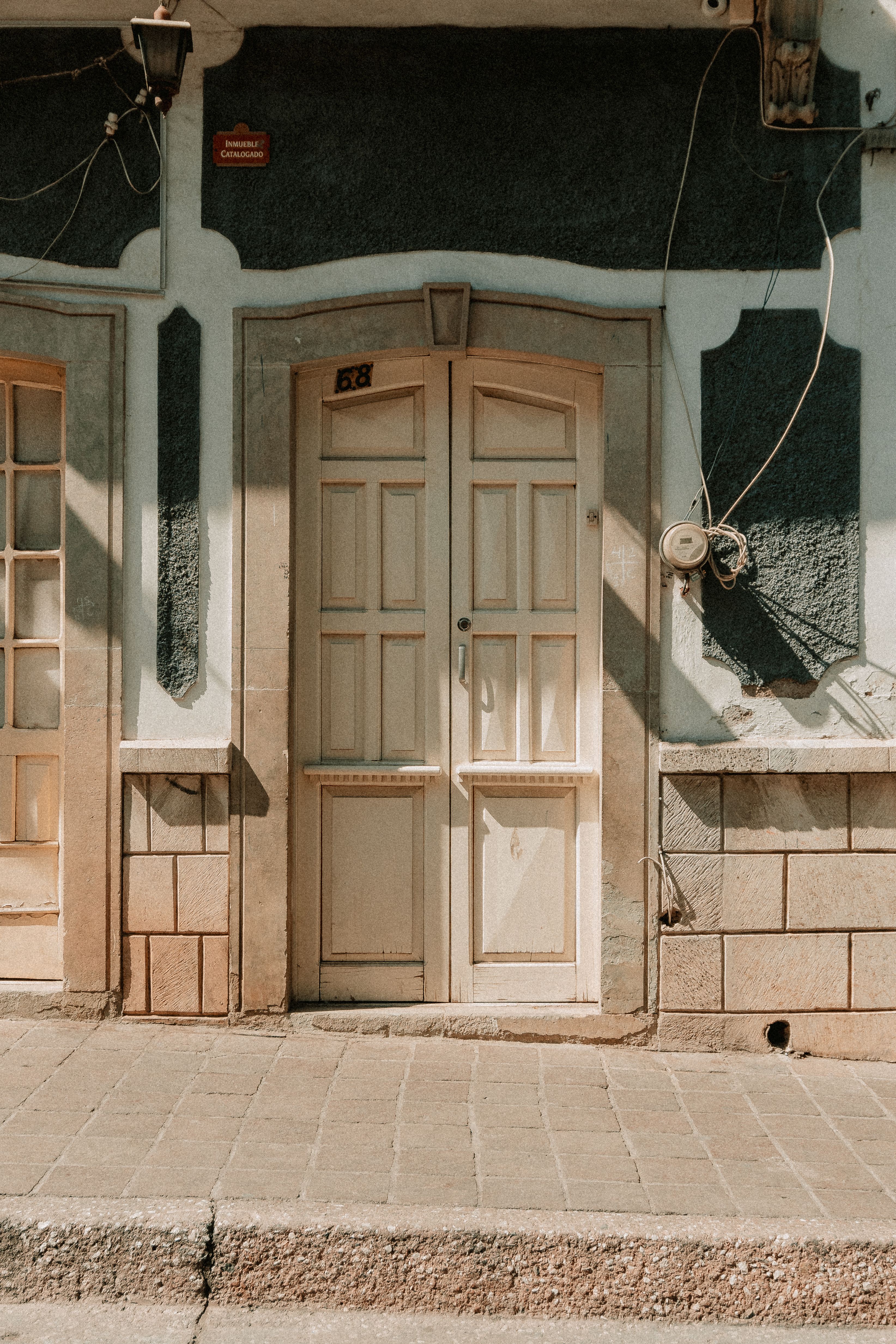Wooden Door of Urban Residential Building · Free Stock Photo