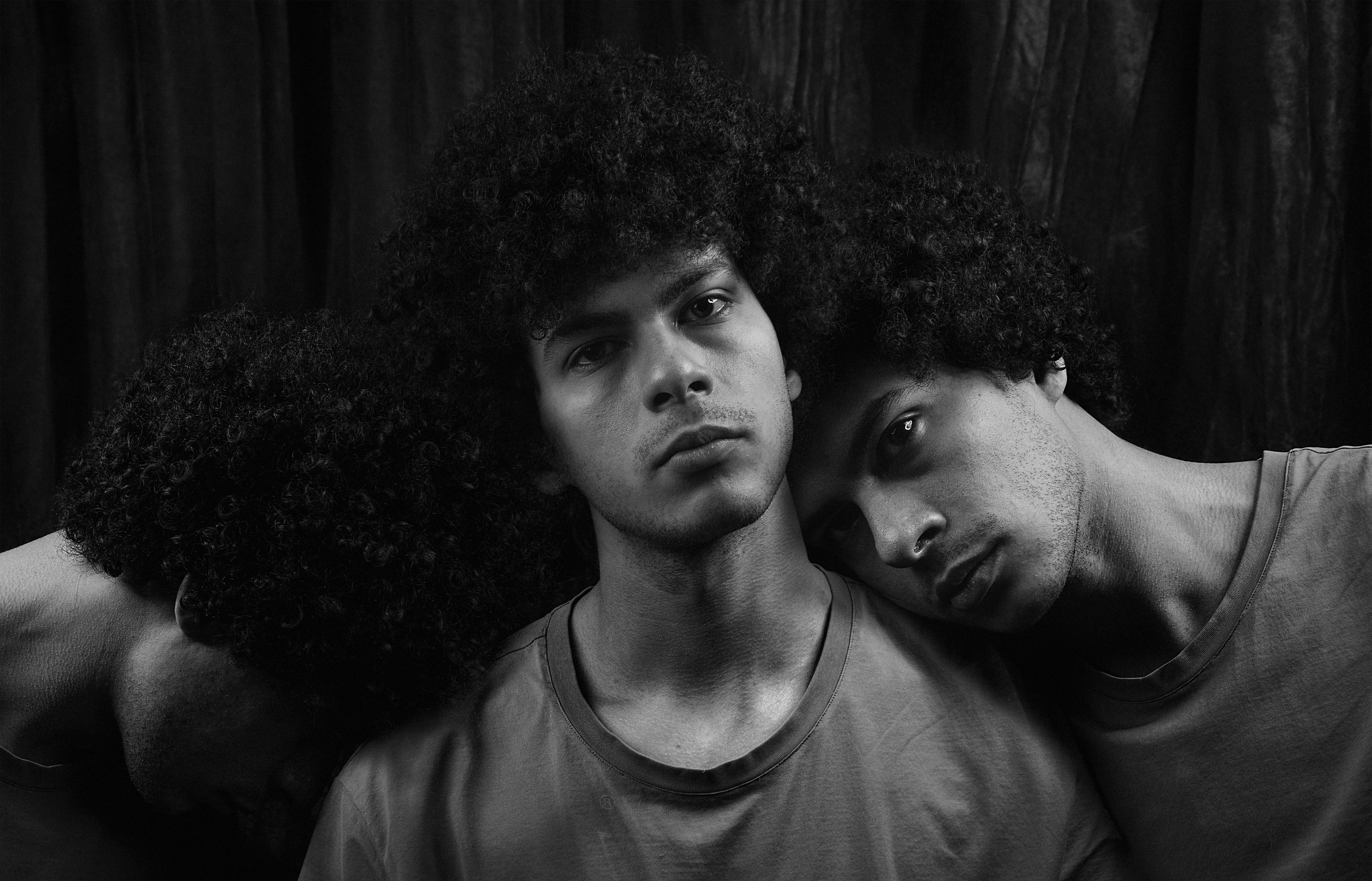 Triplets with Their Heads Resting on Their Brothers Shoulders · Free ...