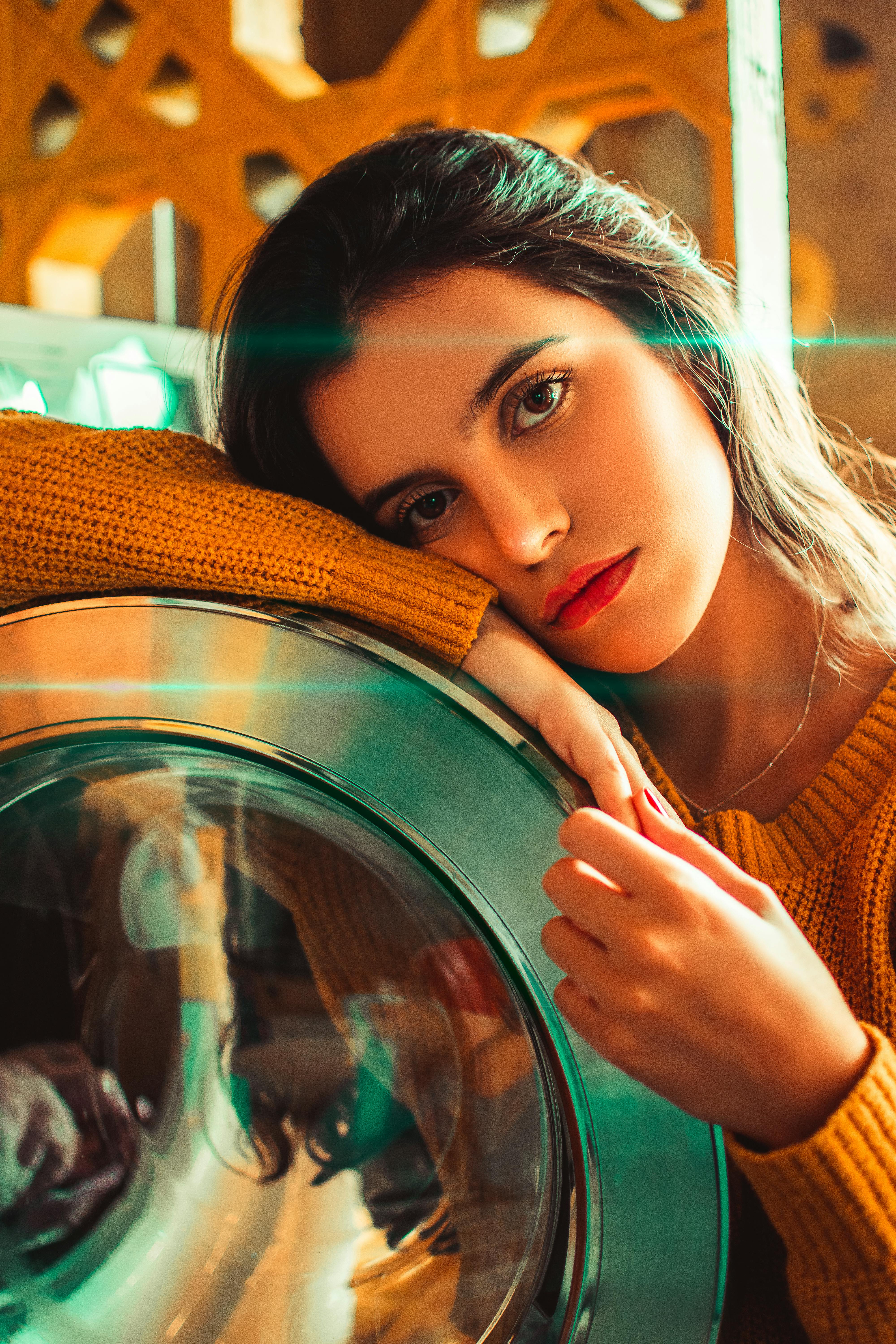 Woman Leaning On Washing Machine · Free Stock Photo