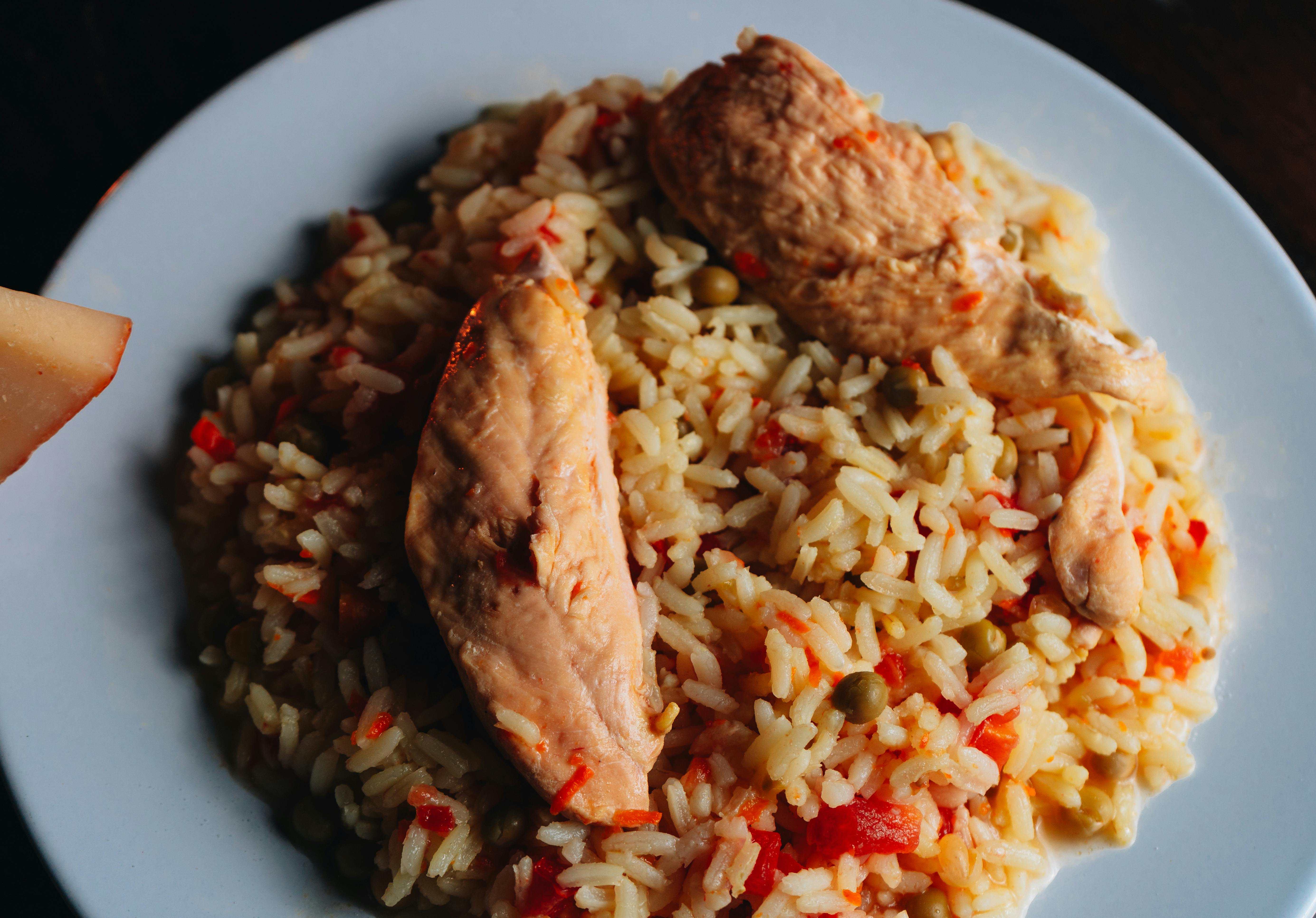 A plate of rice and chicken with peppers · Free Stock Photo