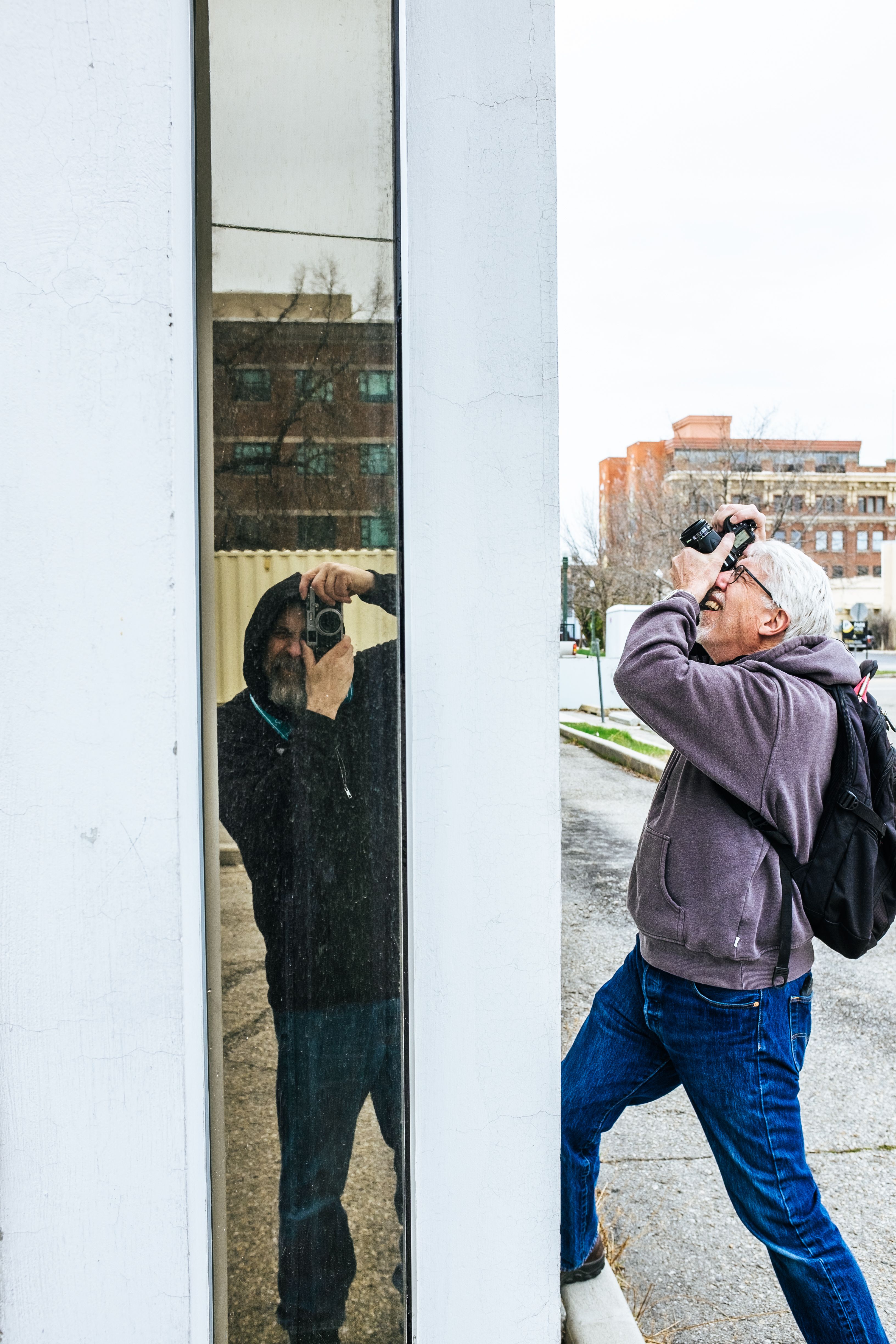 Two Men Holding Cameras · Free Stock Photo