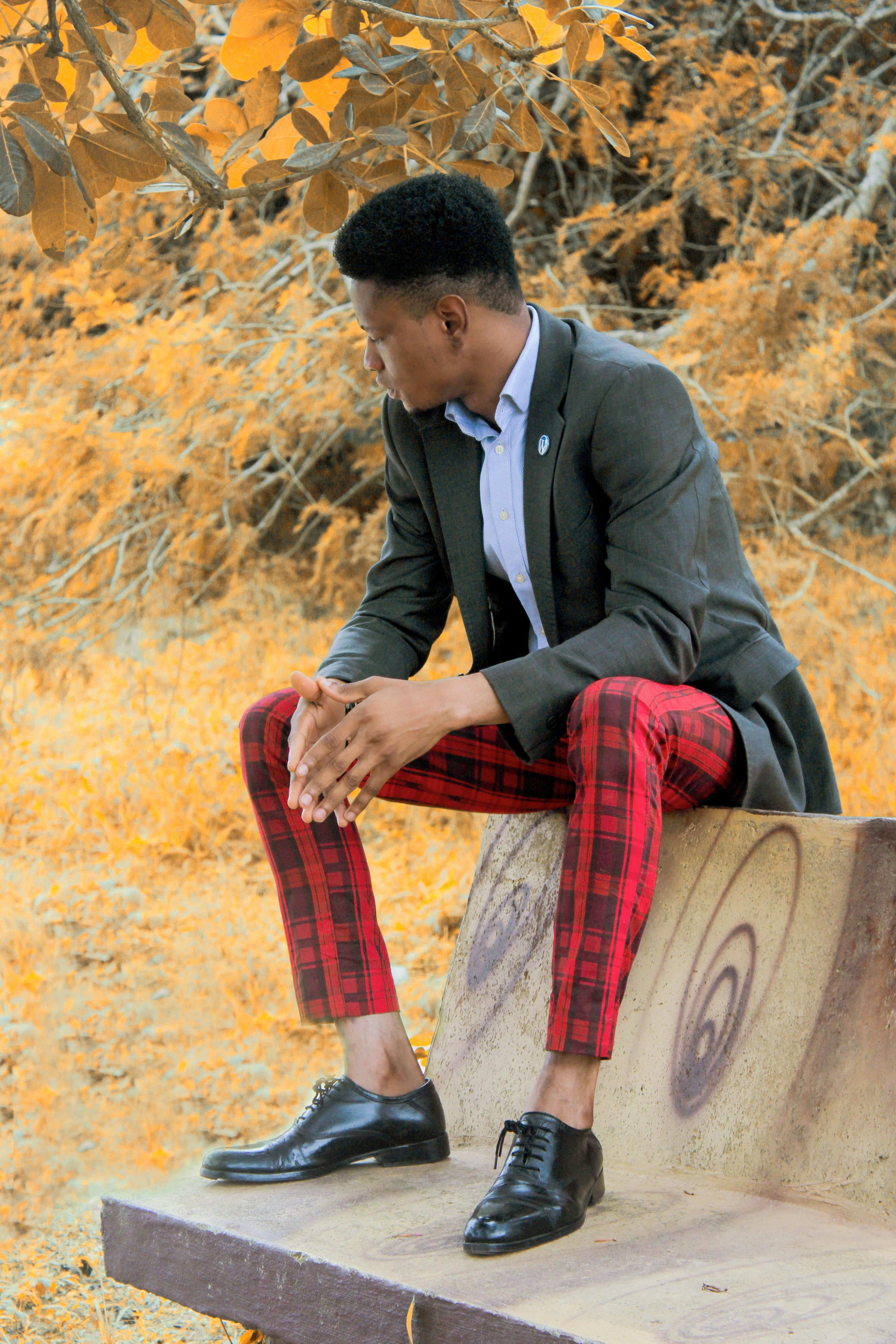 Man In Black Suit Sitting on Bench · Free Stock Photo