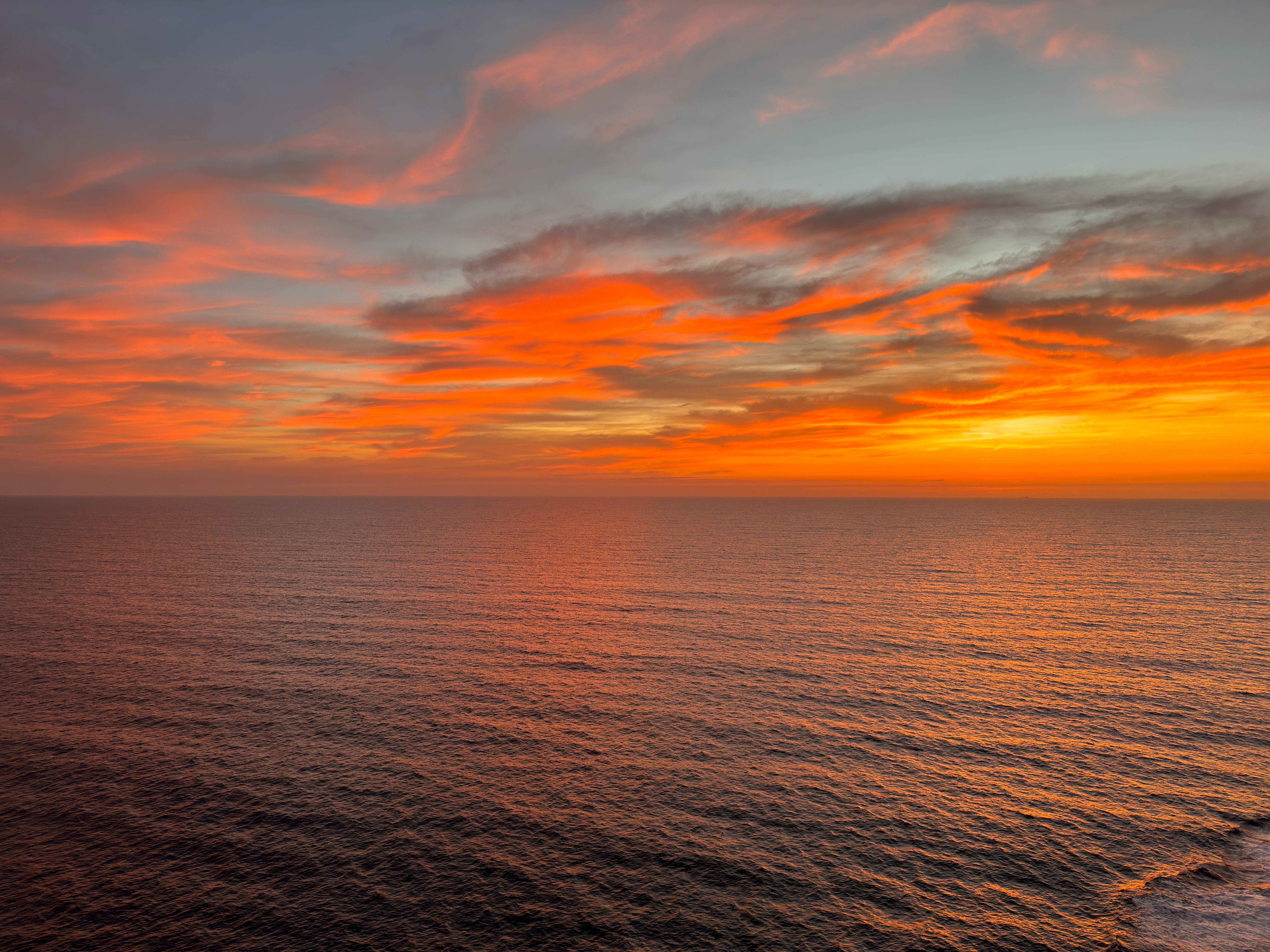 Yellow Sky over Ocean at Sunset · Free Stock Photo
