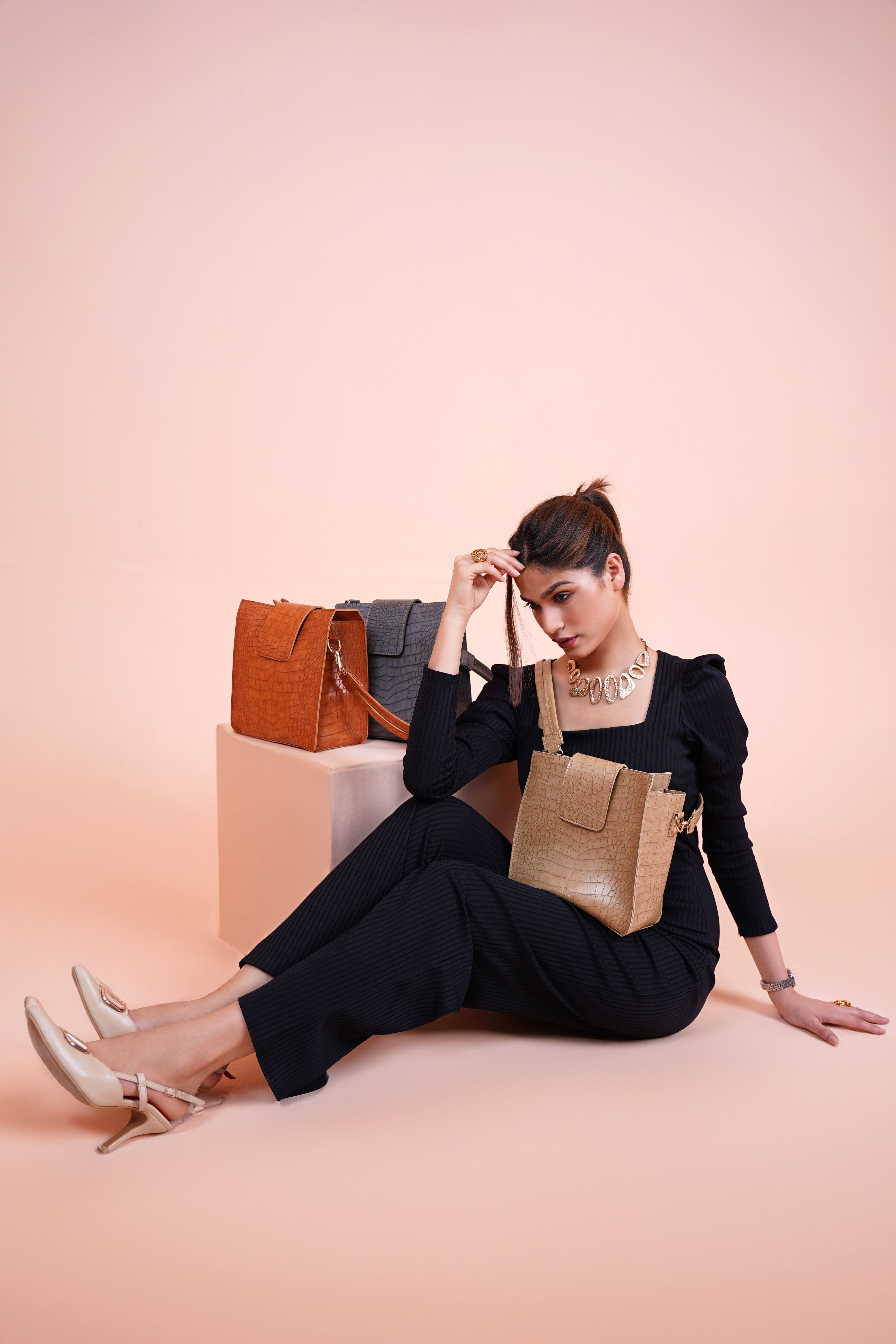 Woman Posing with Bags in Studio · Free Stock Photo