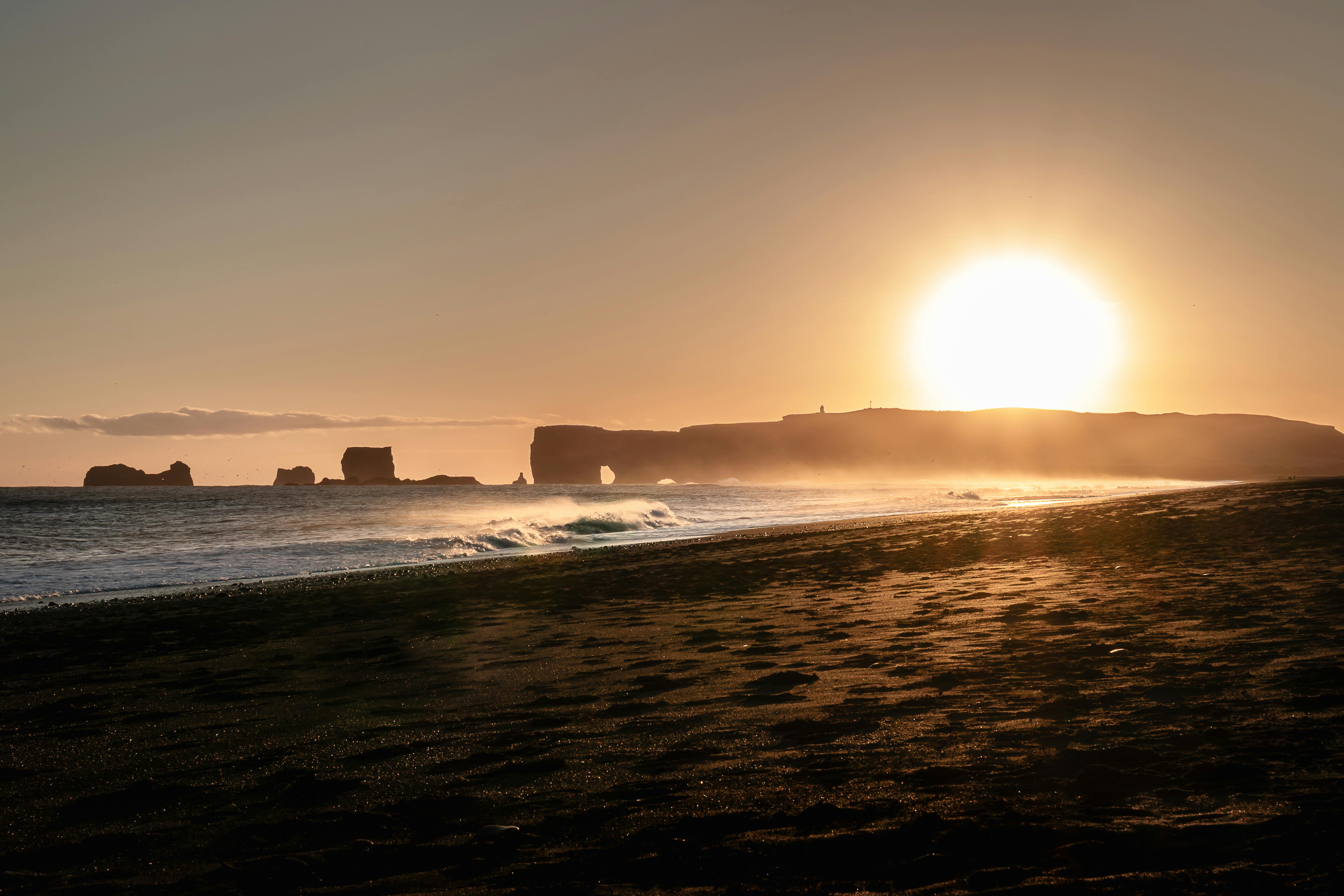 Sunset Sunlight over Beach on Sea Shore with Cliff behind · Free Stock ...