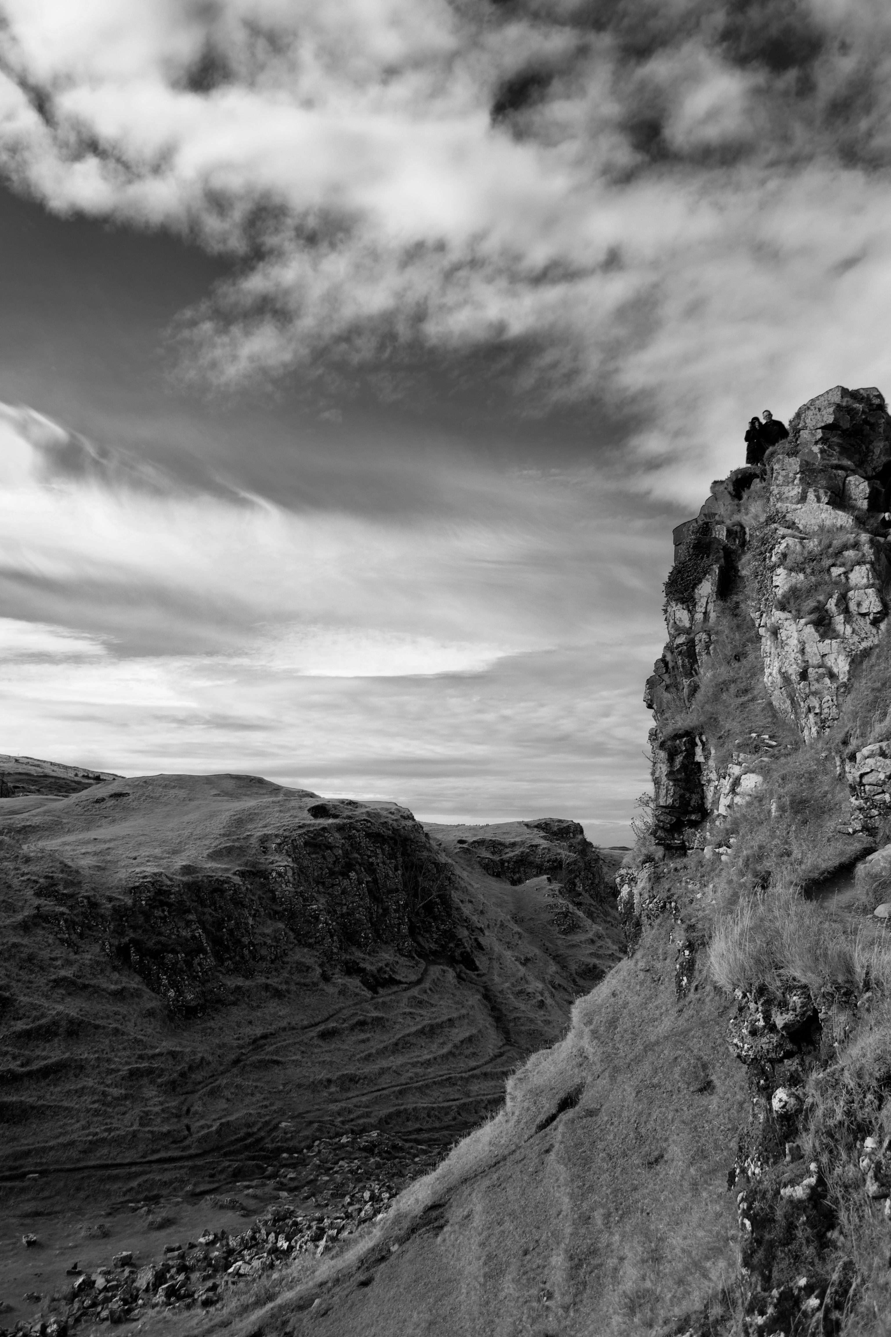 Black and white photo of a cliff with clouds · Free Stock Photo