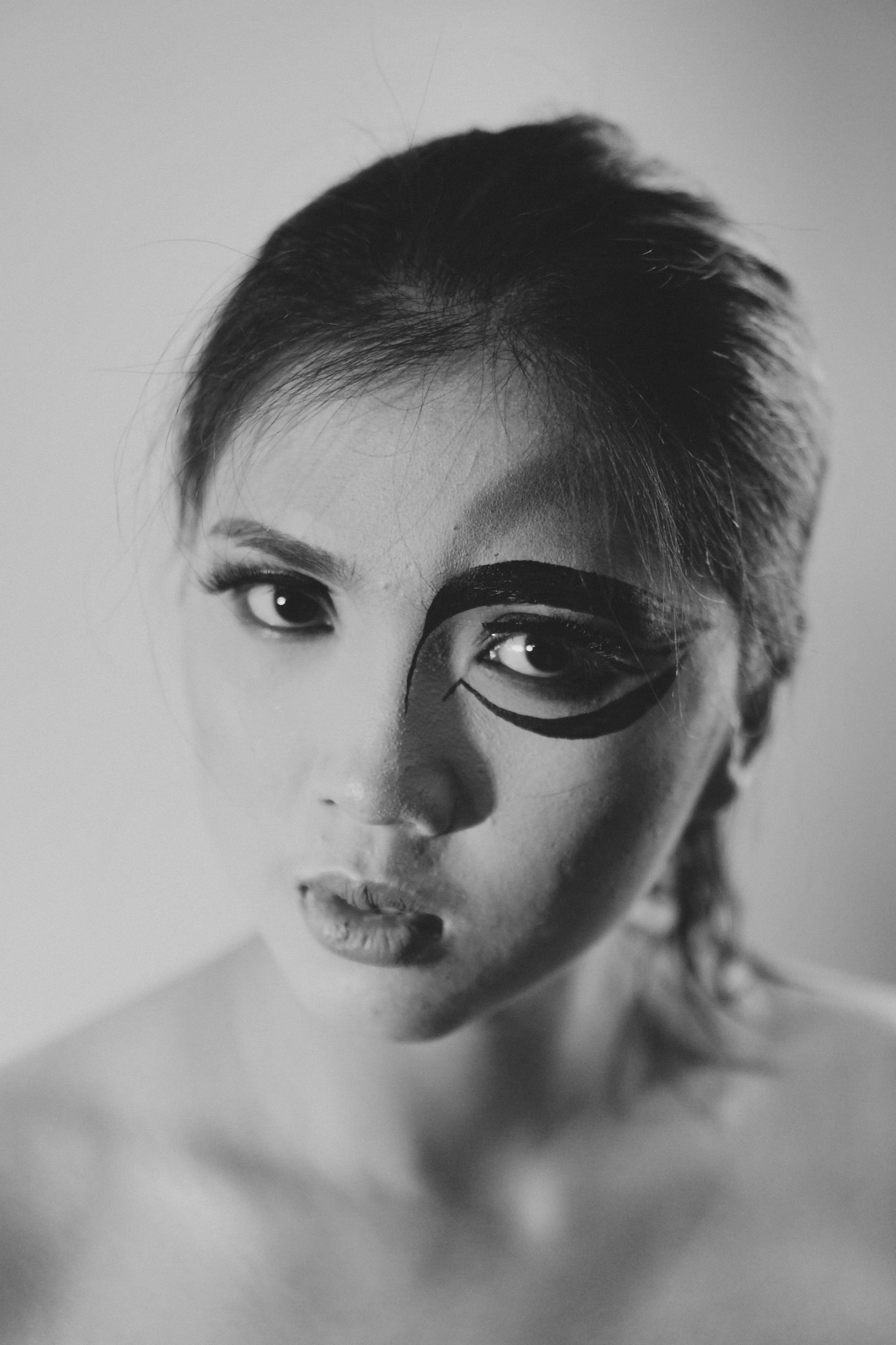 Black and White Portrait of a Woman with an Eye Painting · Free Stock Photo
