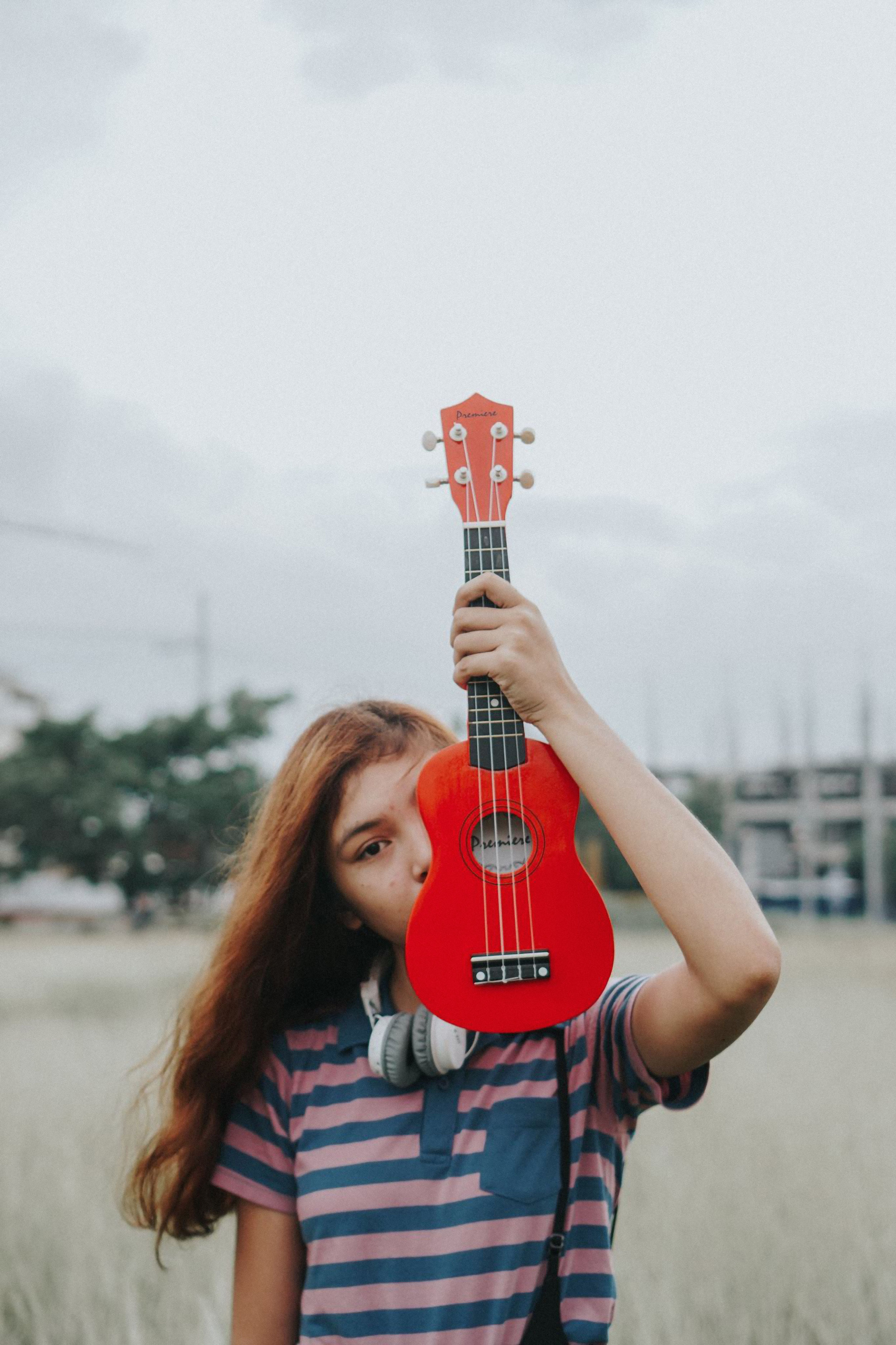 Young Woman Holding Ukulele · Free Stock Photo