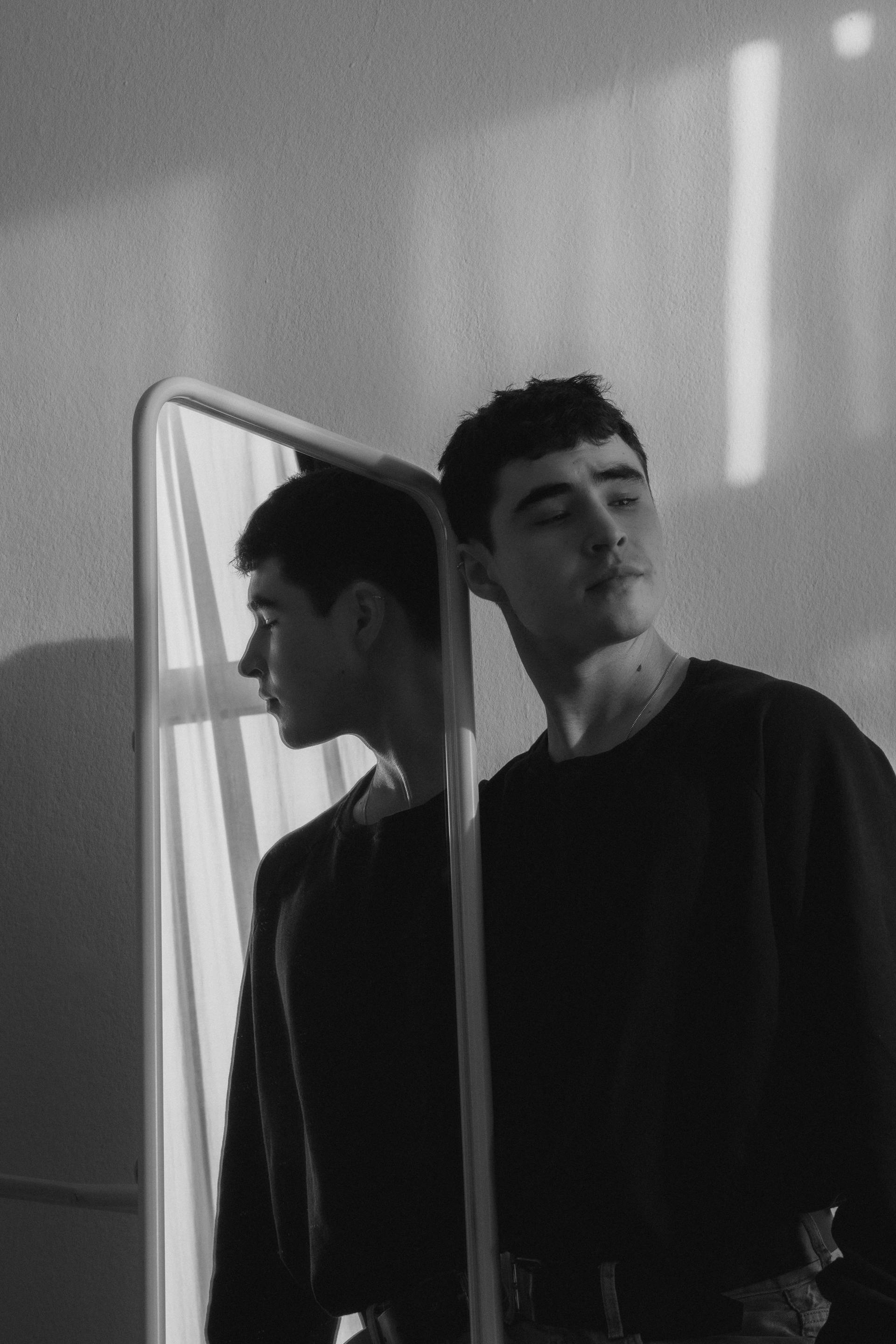 A Young Man by the Mirror · Free Stock Photo