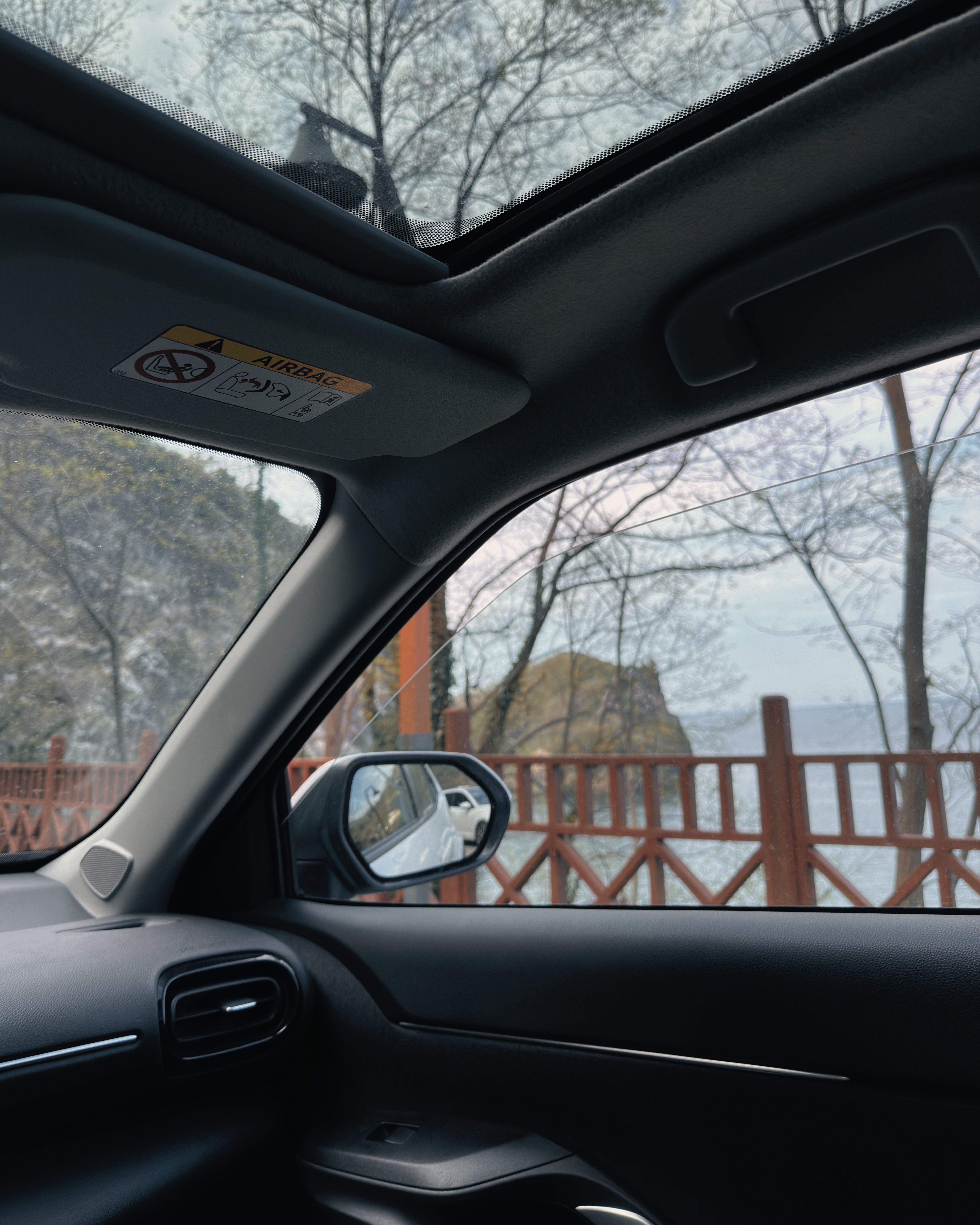 Woman in Sweater Sitting Inside Car Looking Out the Window · Free Stock ...