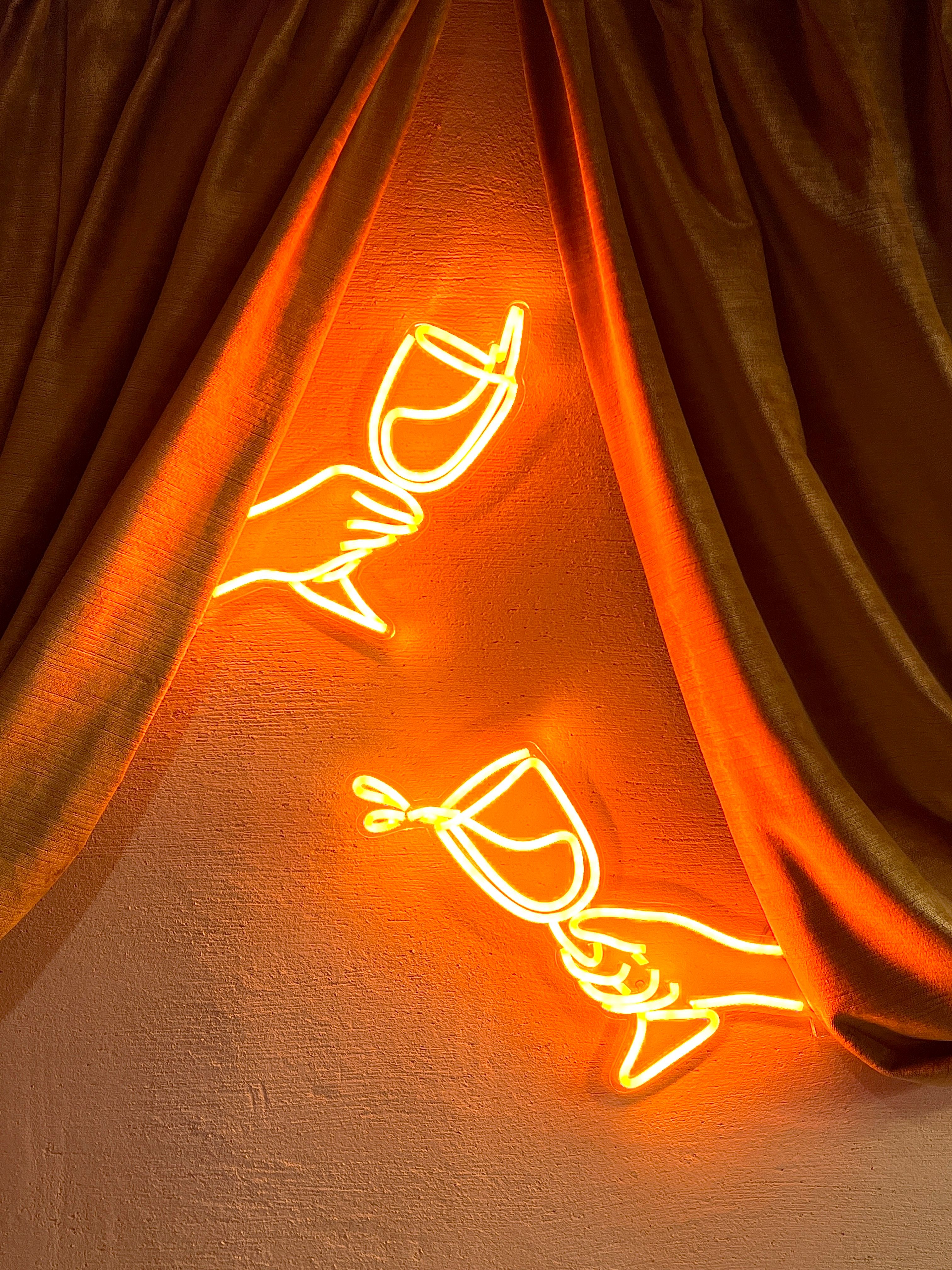 An Orange Neon Sign on a Wall · Free Stock Photo