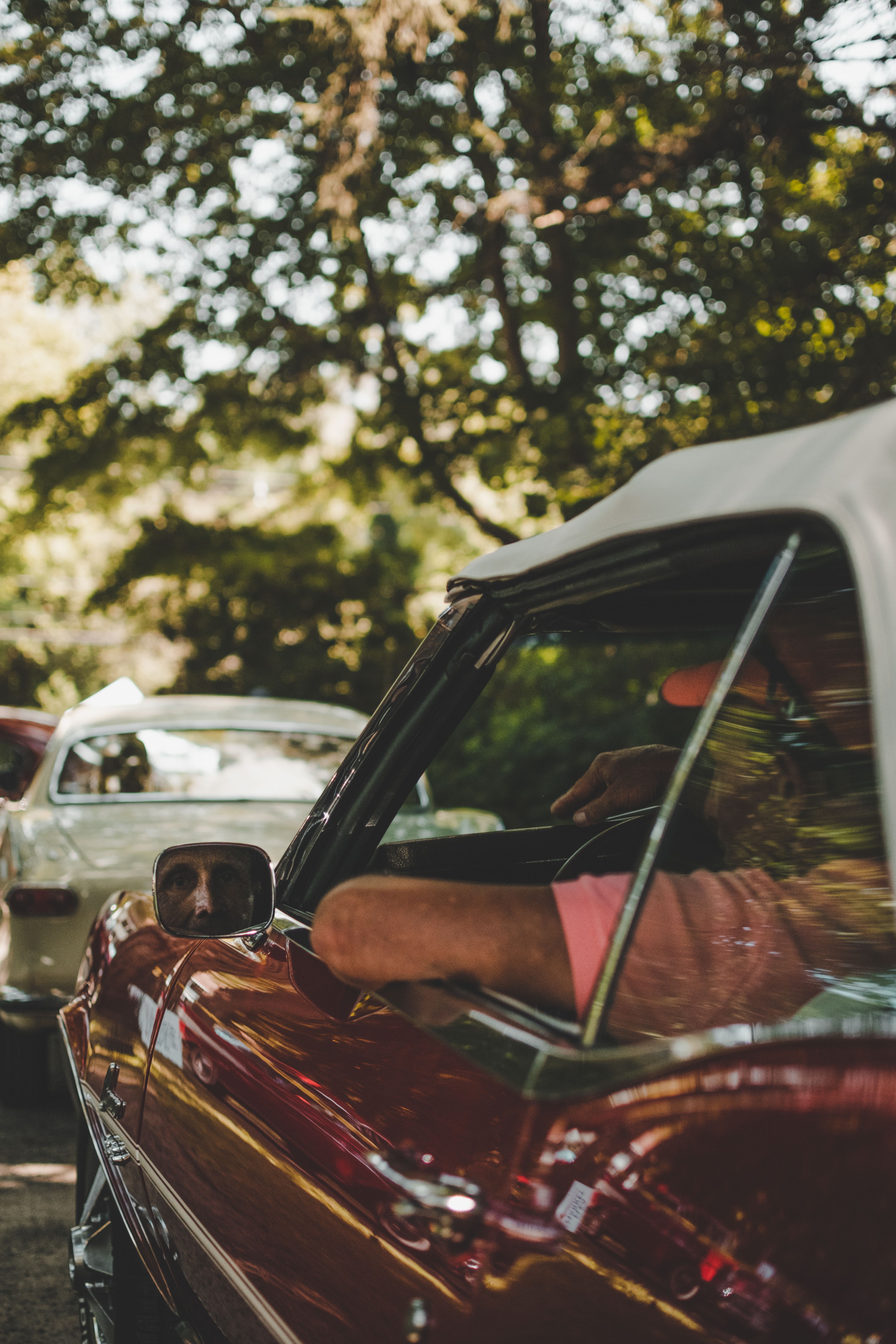 Elbow of Driver on Door of Red Classic Car · Free Stock Photo