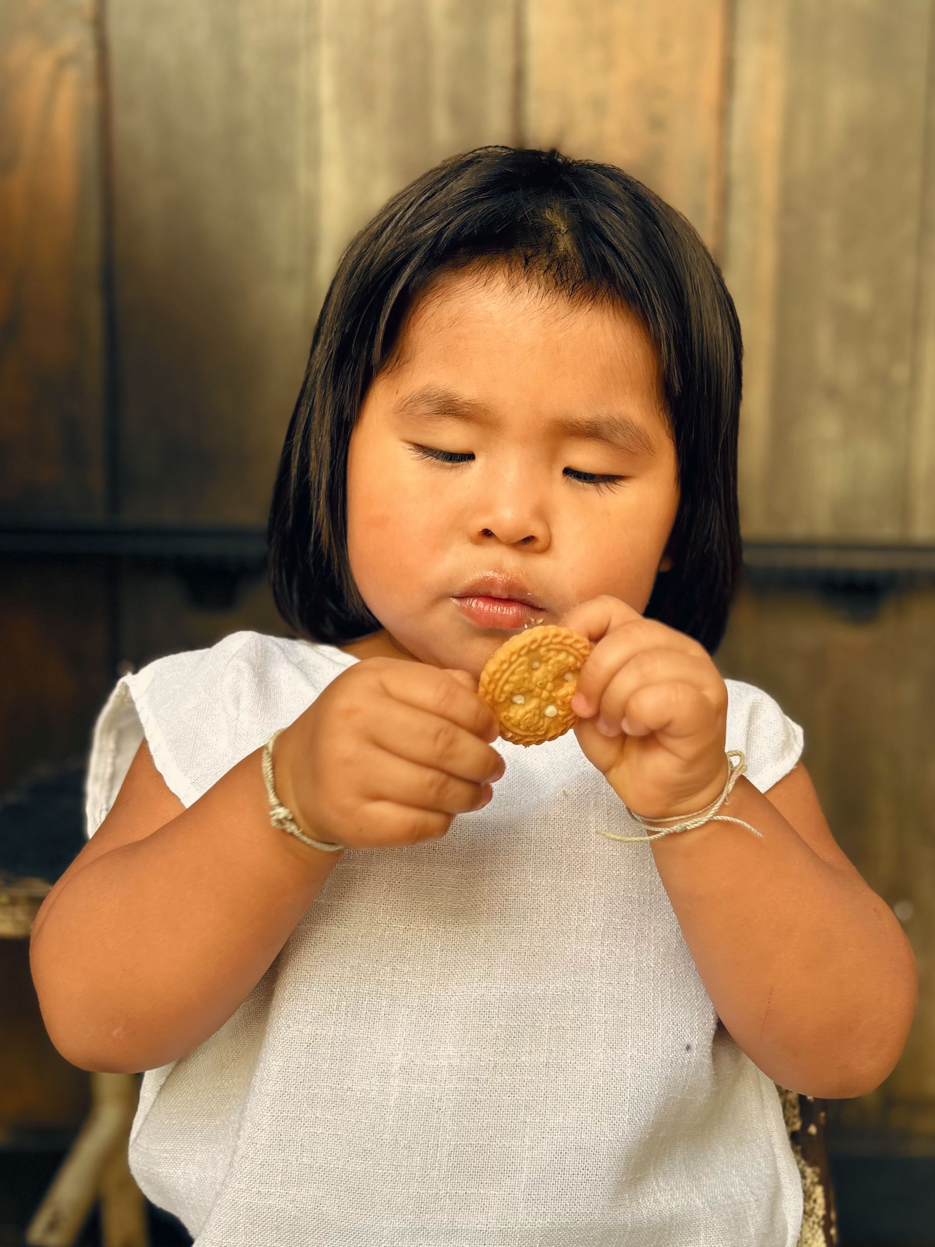 Portrait of Girl with Cookie · Free Stock Photo