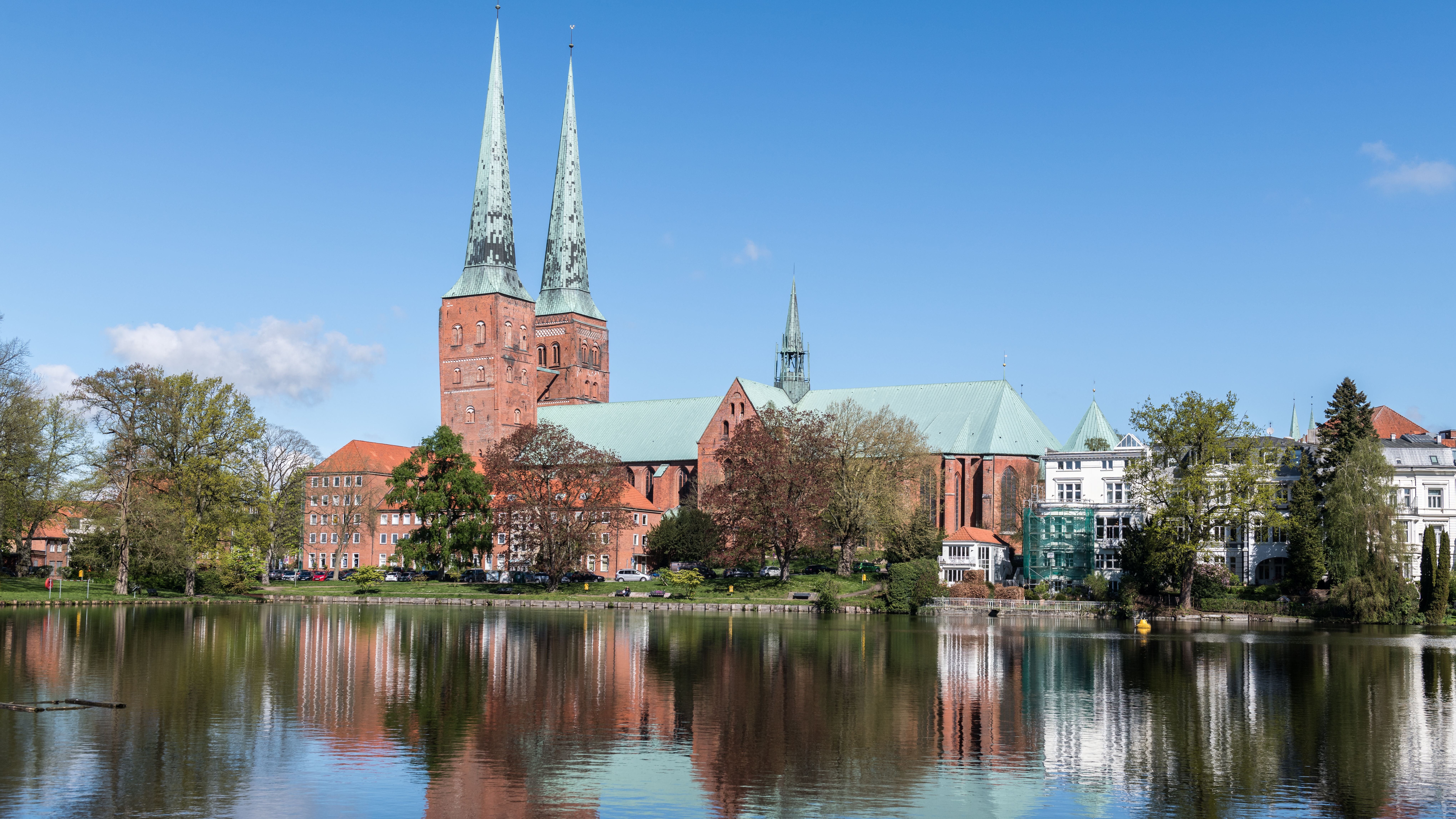 Lubeck Cathedral Towers over River in Lubeck in Germany · Free Stock Photo