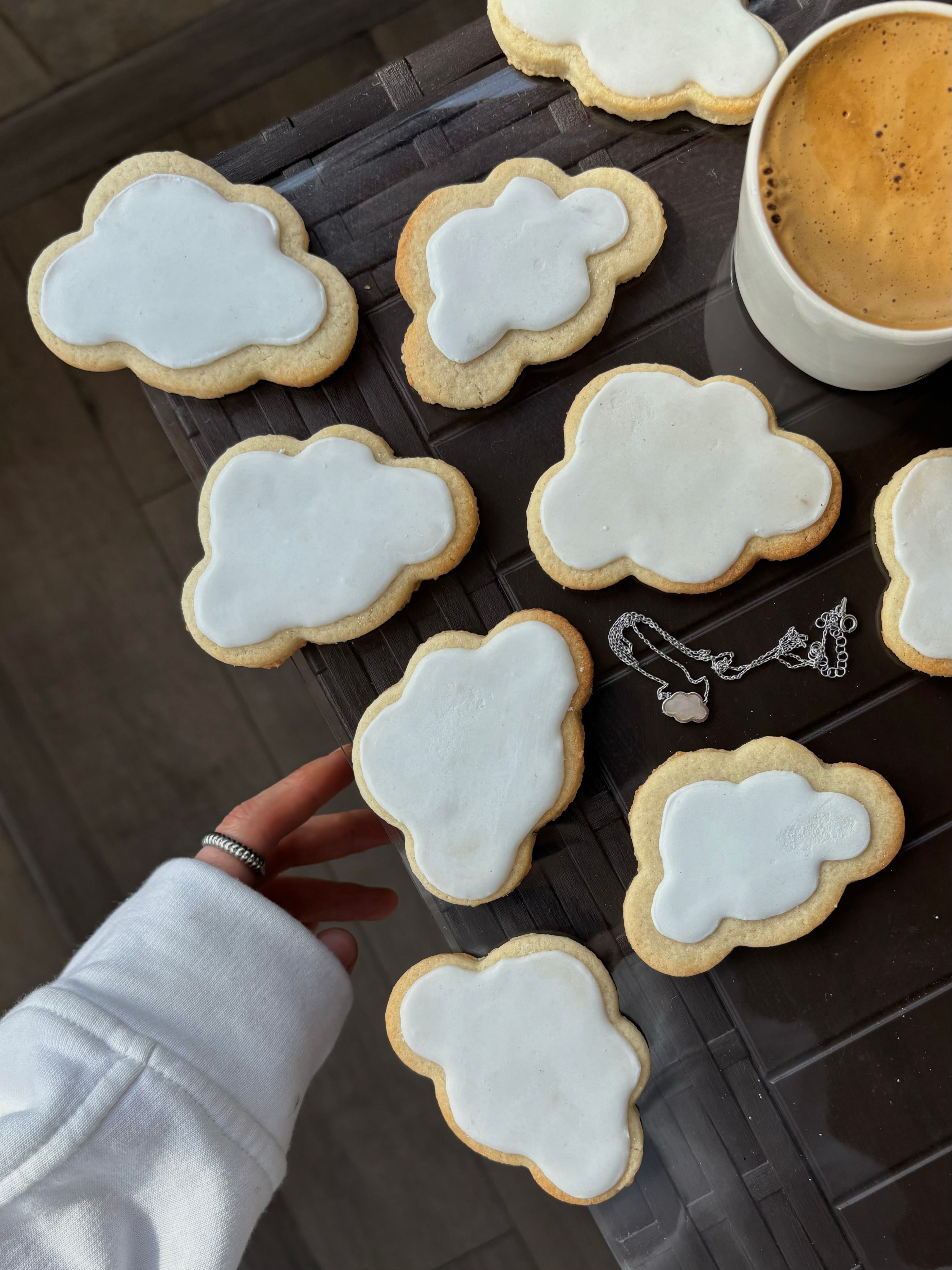 Woman Hand over Cookies with Icing and Necklace · Free Stock Photo
