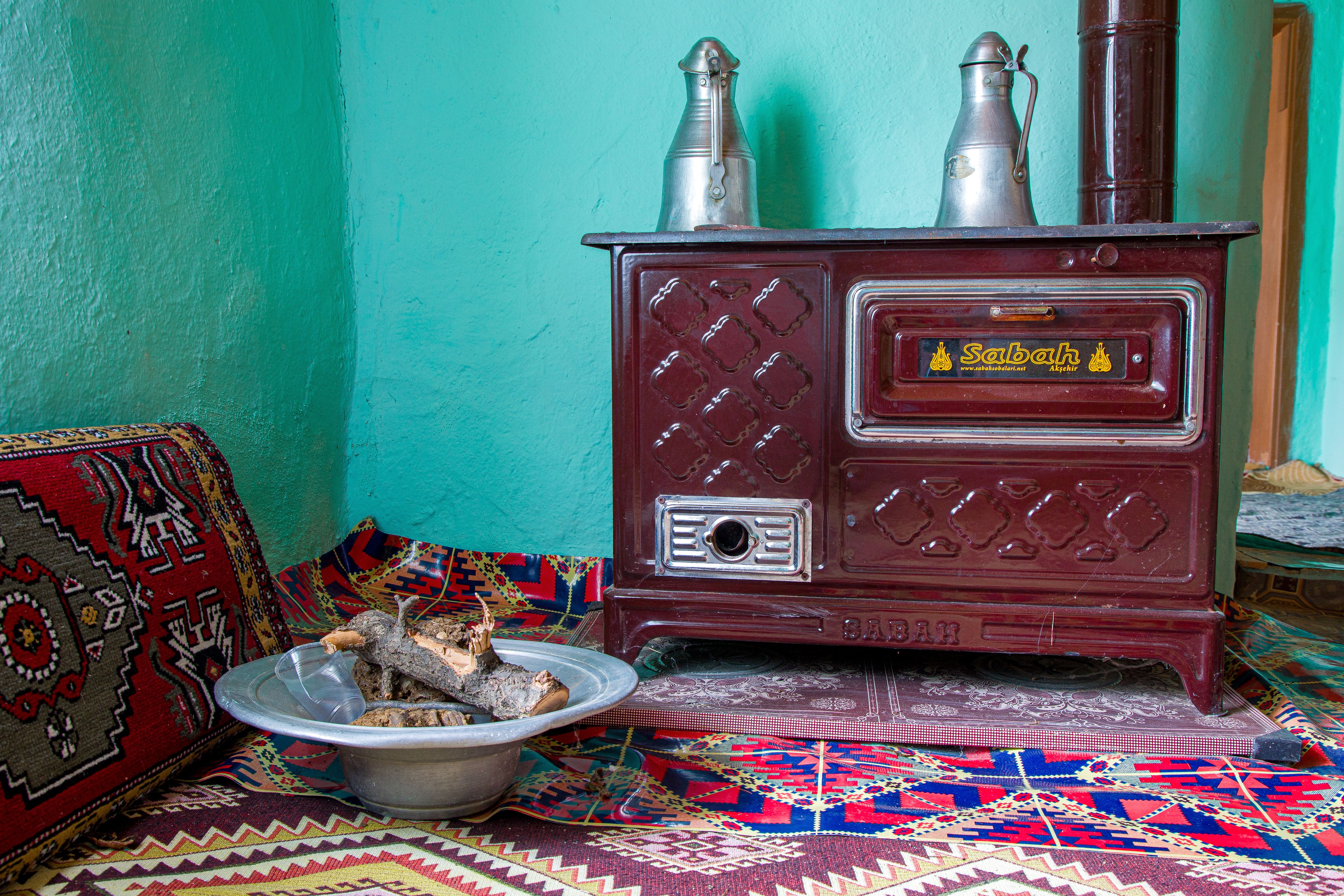Brown Sabah Wood Stove in a Blue Room · Free Stock Photo