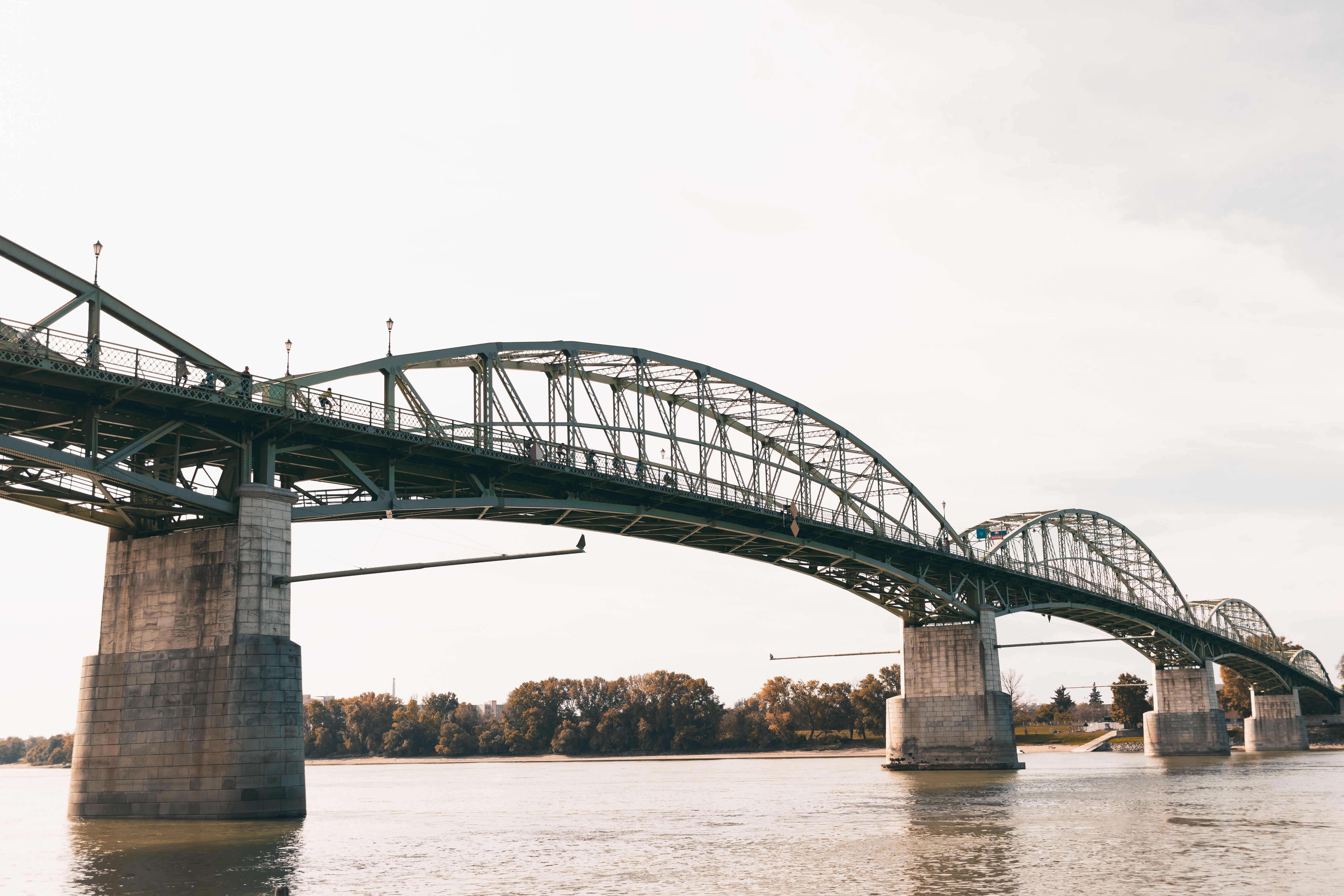 A bridge over a body of water with a large bridge · Free Stock Photo