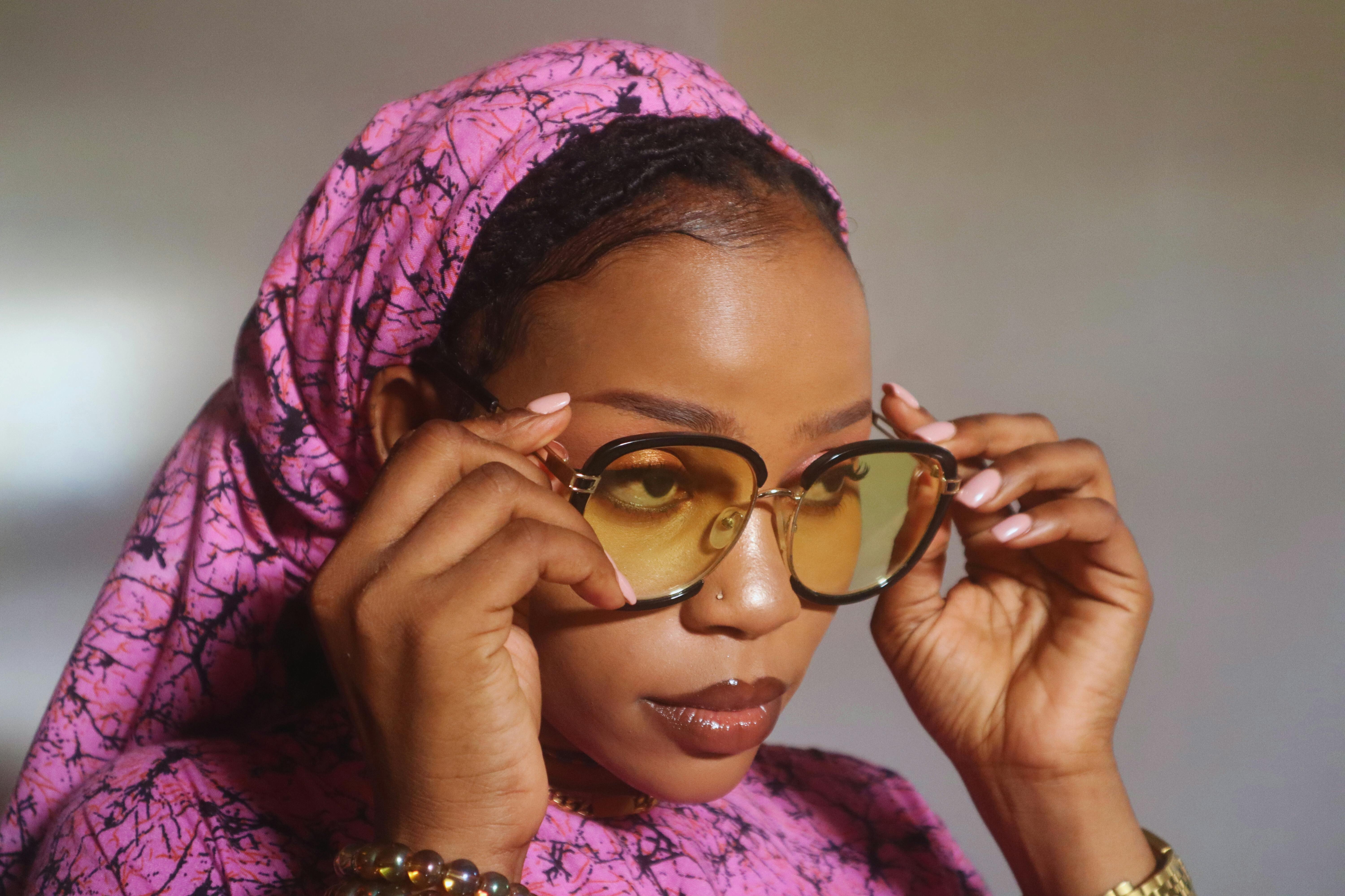 Close-up of a Woman Holding Her Glasses · Free Stock Photo
