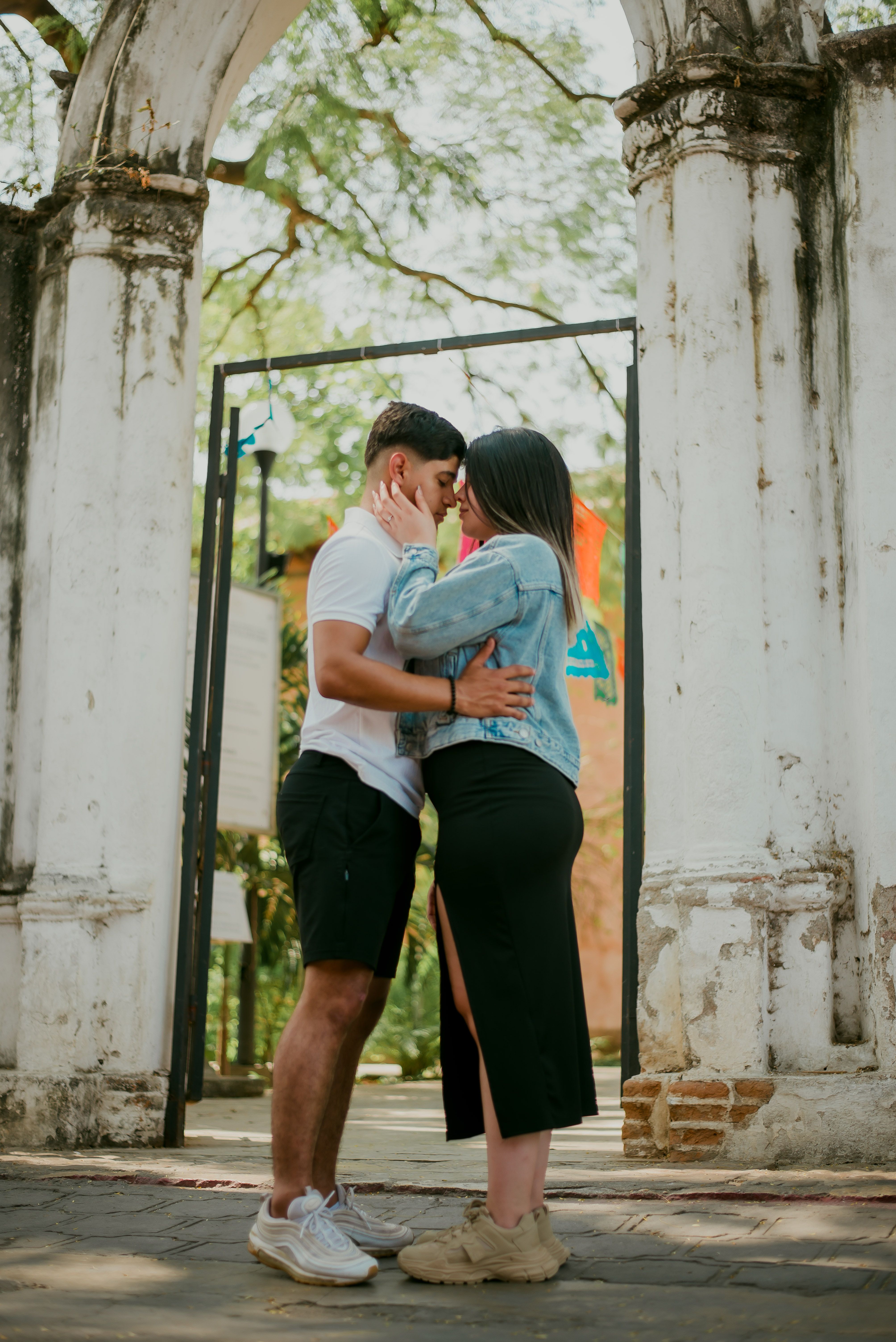 Woman in Jacket and Dress Hugging Man · Free Stock Photo