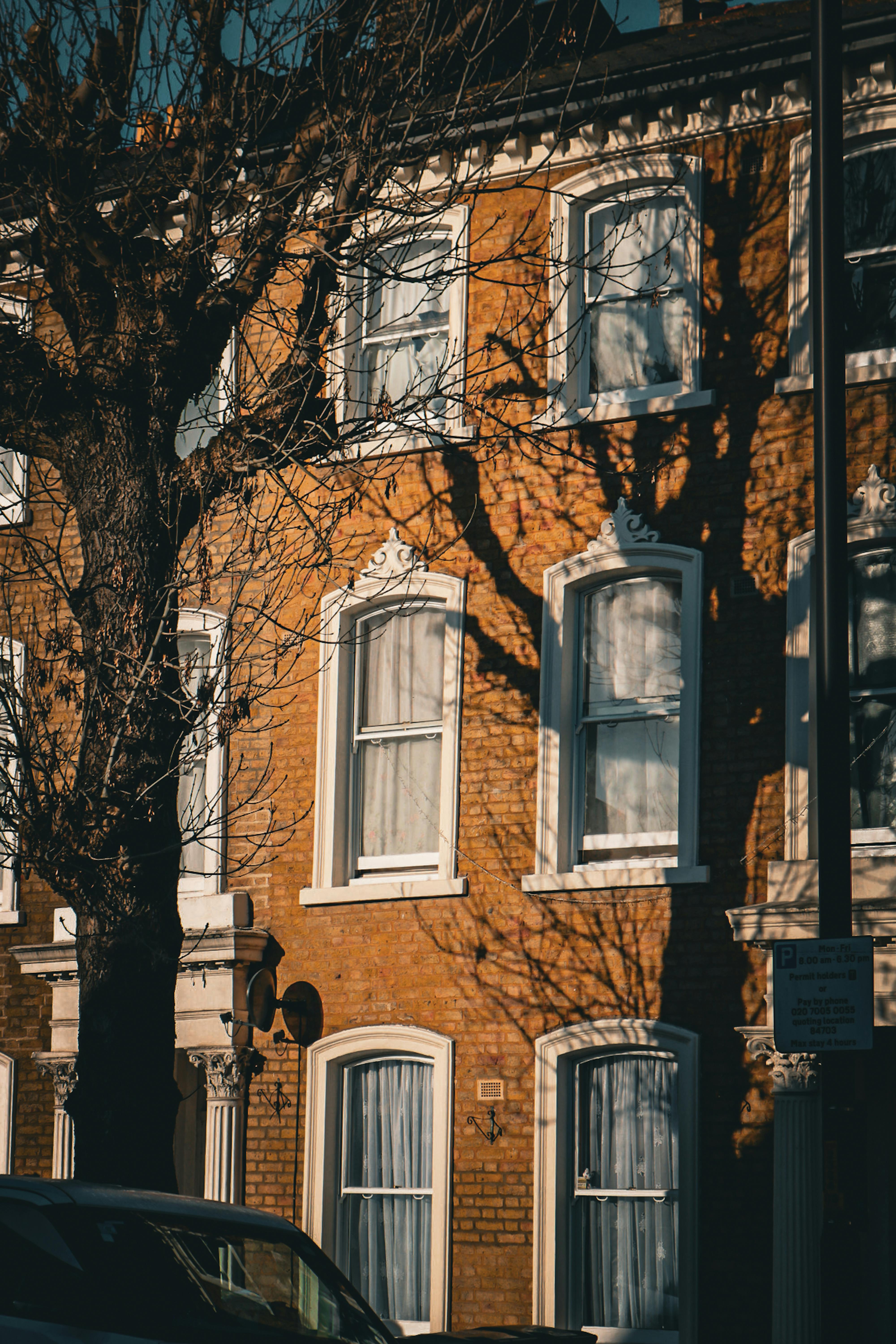Sash Windows of a Brick Apartment Building · Free Stock Photo