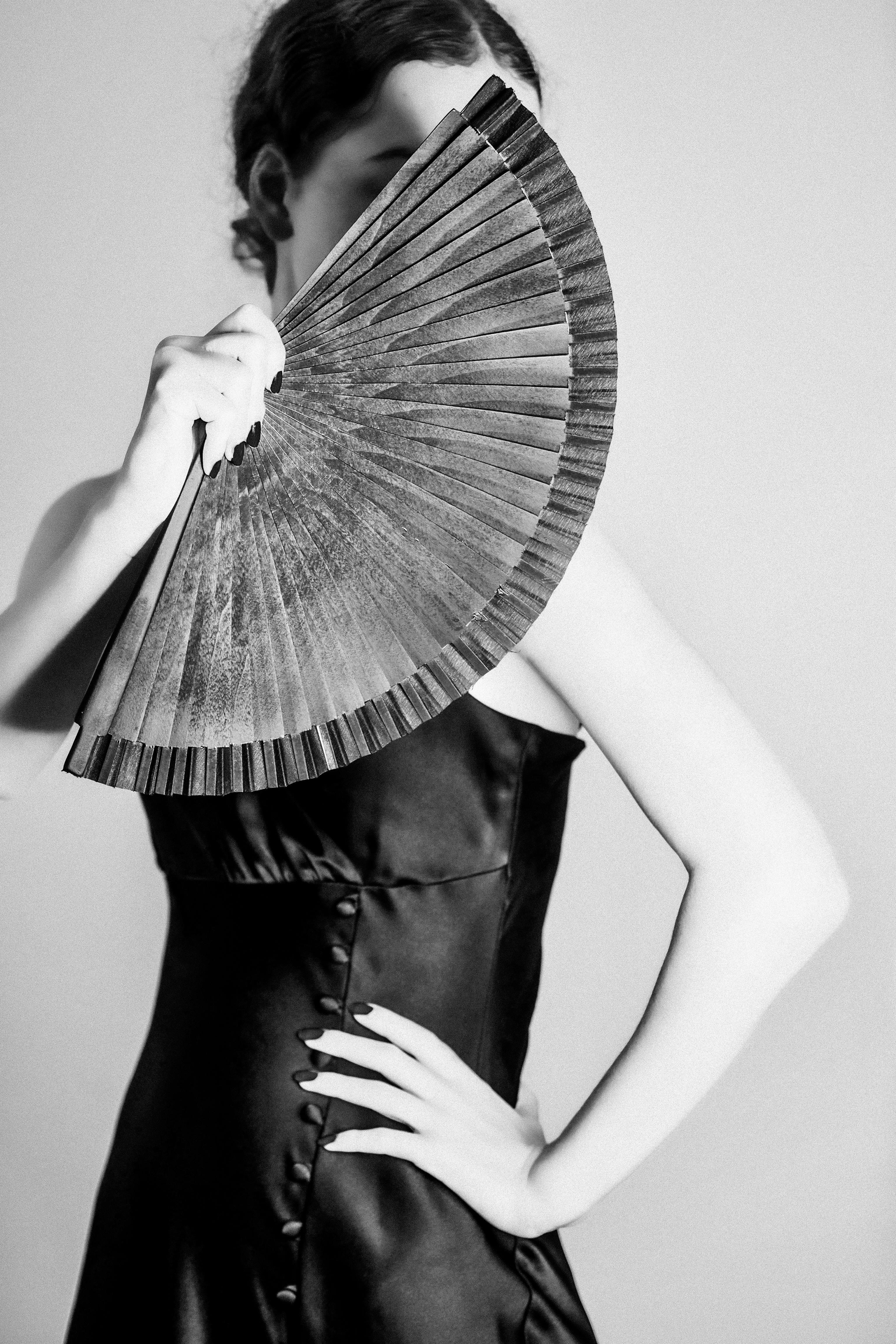 Dancer Hiding Behind a Hand Fan · Free Stock Photo