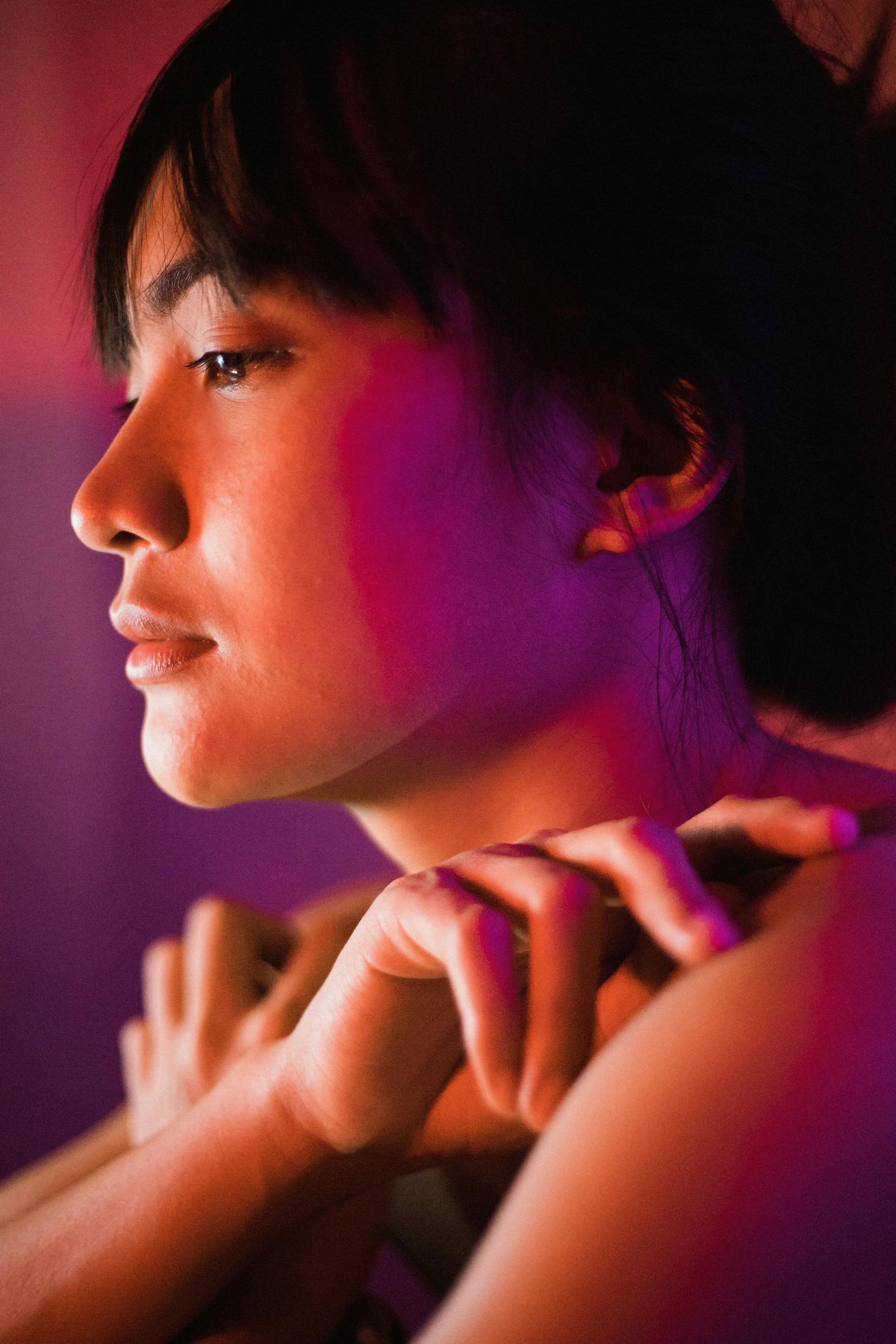 Portrait of a Woman in Dim Light · Free Stock Photo