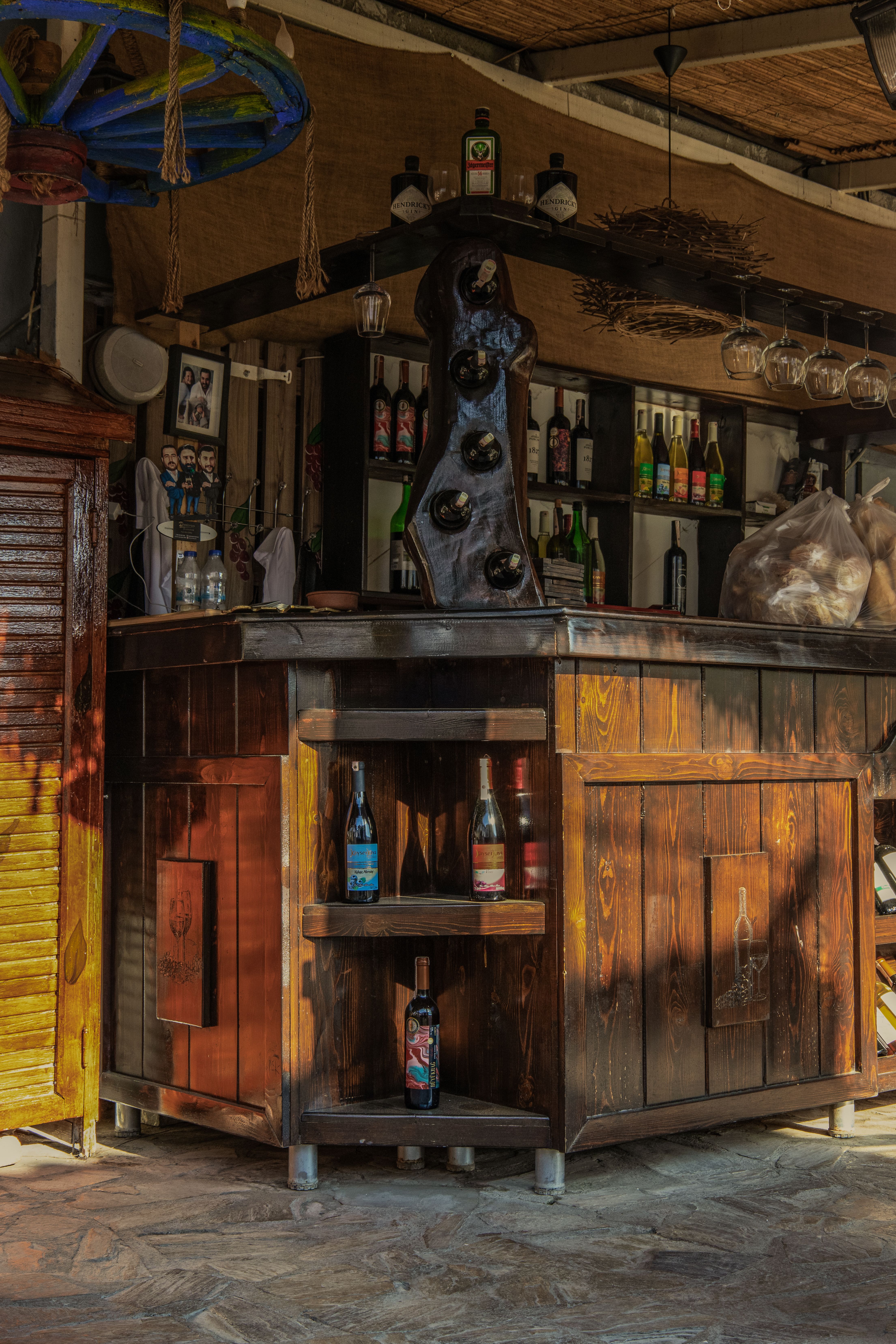 A bar with bottles and bottles on the counter · Free Stock Photo