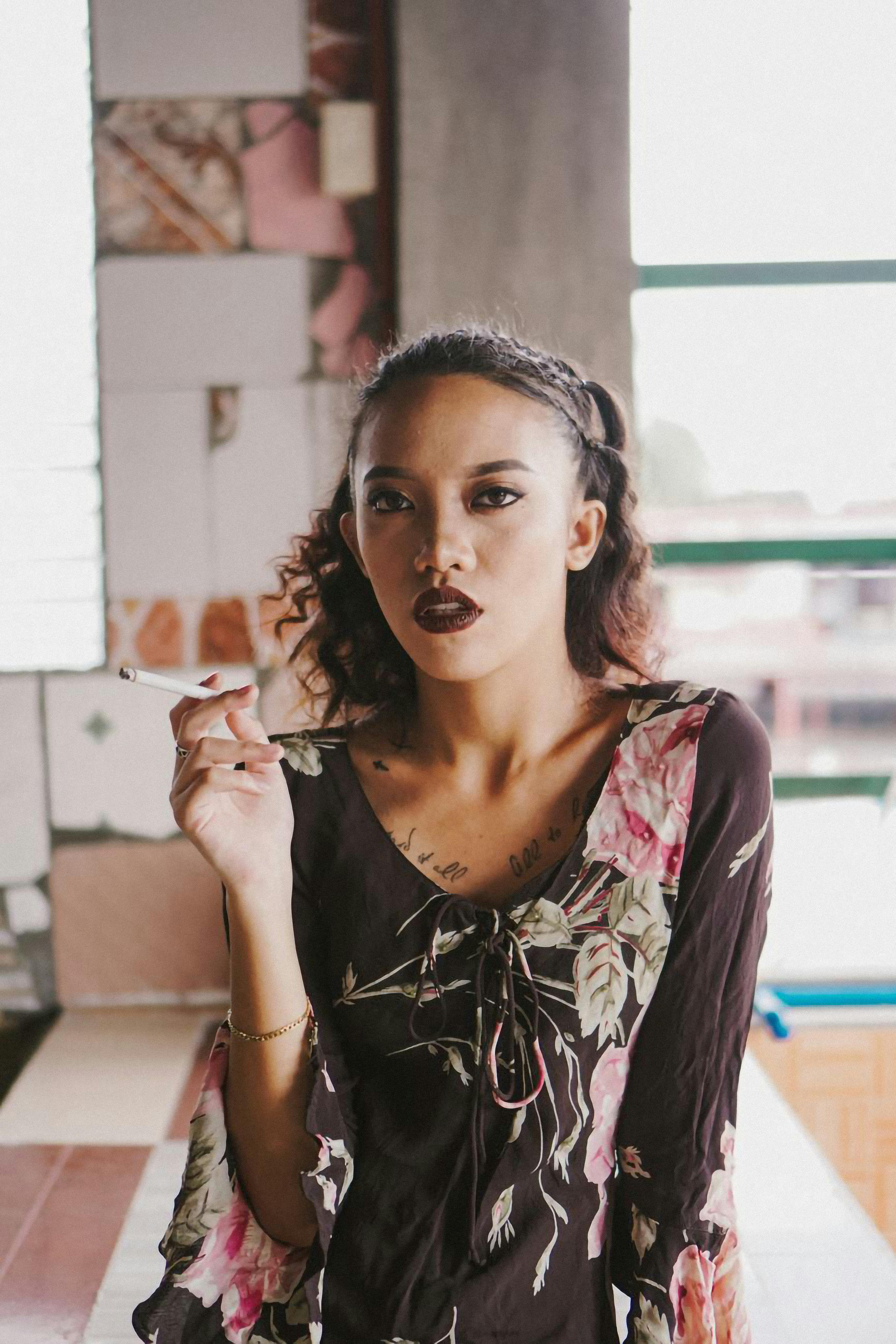 Brunette Wearing Makeup Smoking Cigarette · Free Stock Photo