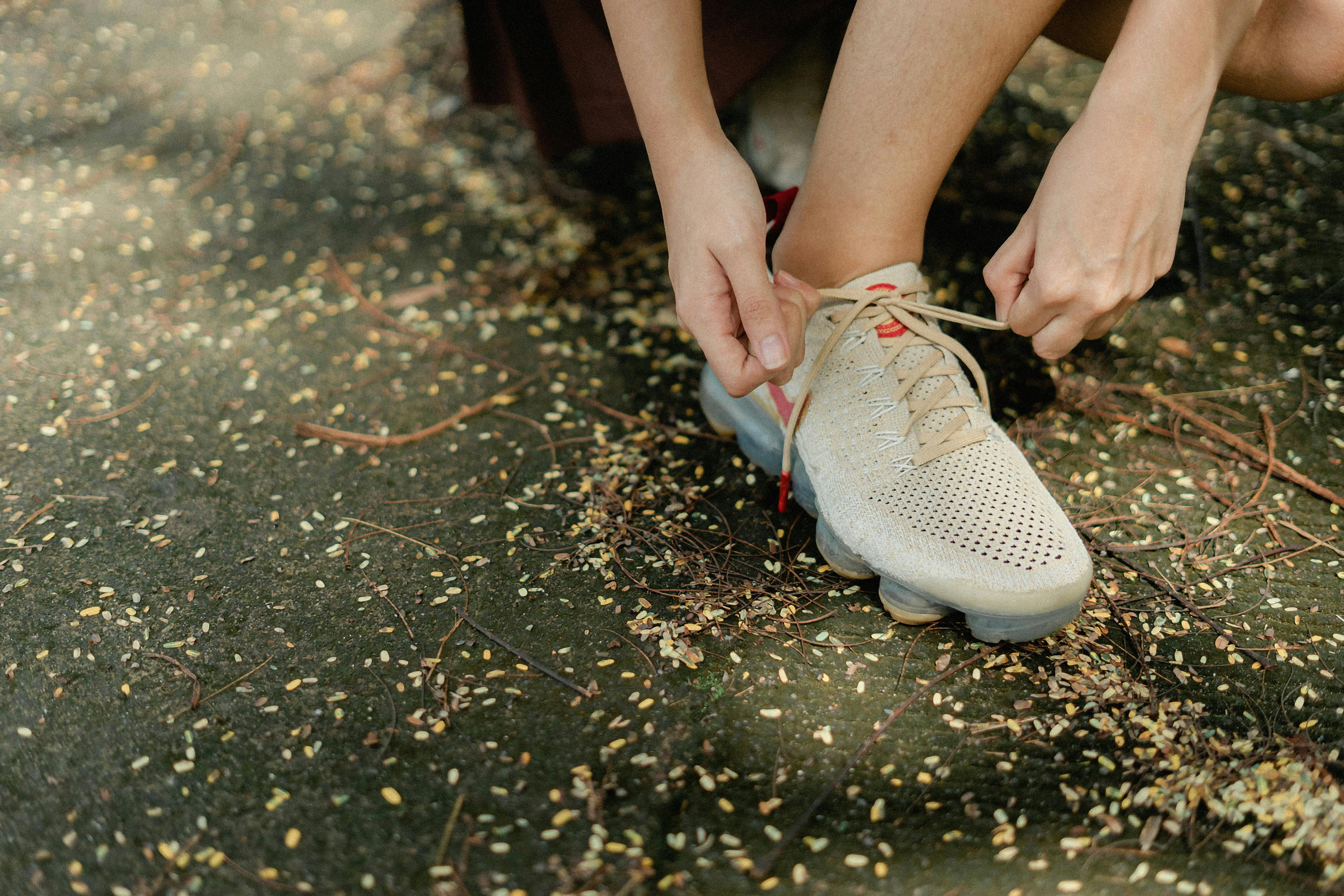 Woman Tying Shoelace · Free Stock Photo