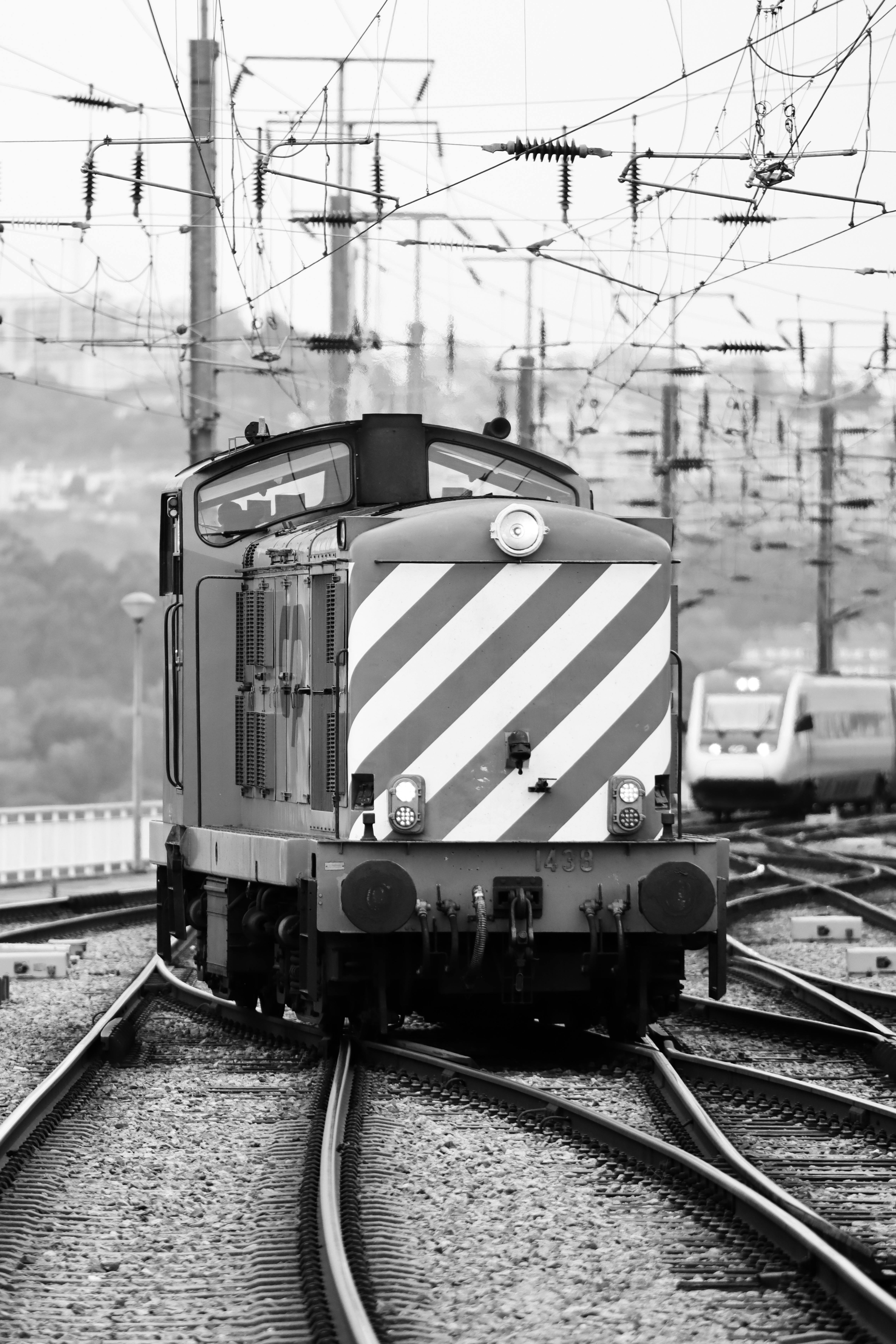 Grayscale Photograph of Train Rail · Free Stock Photo
