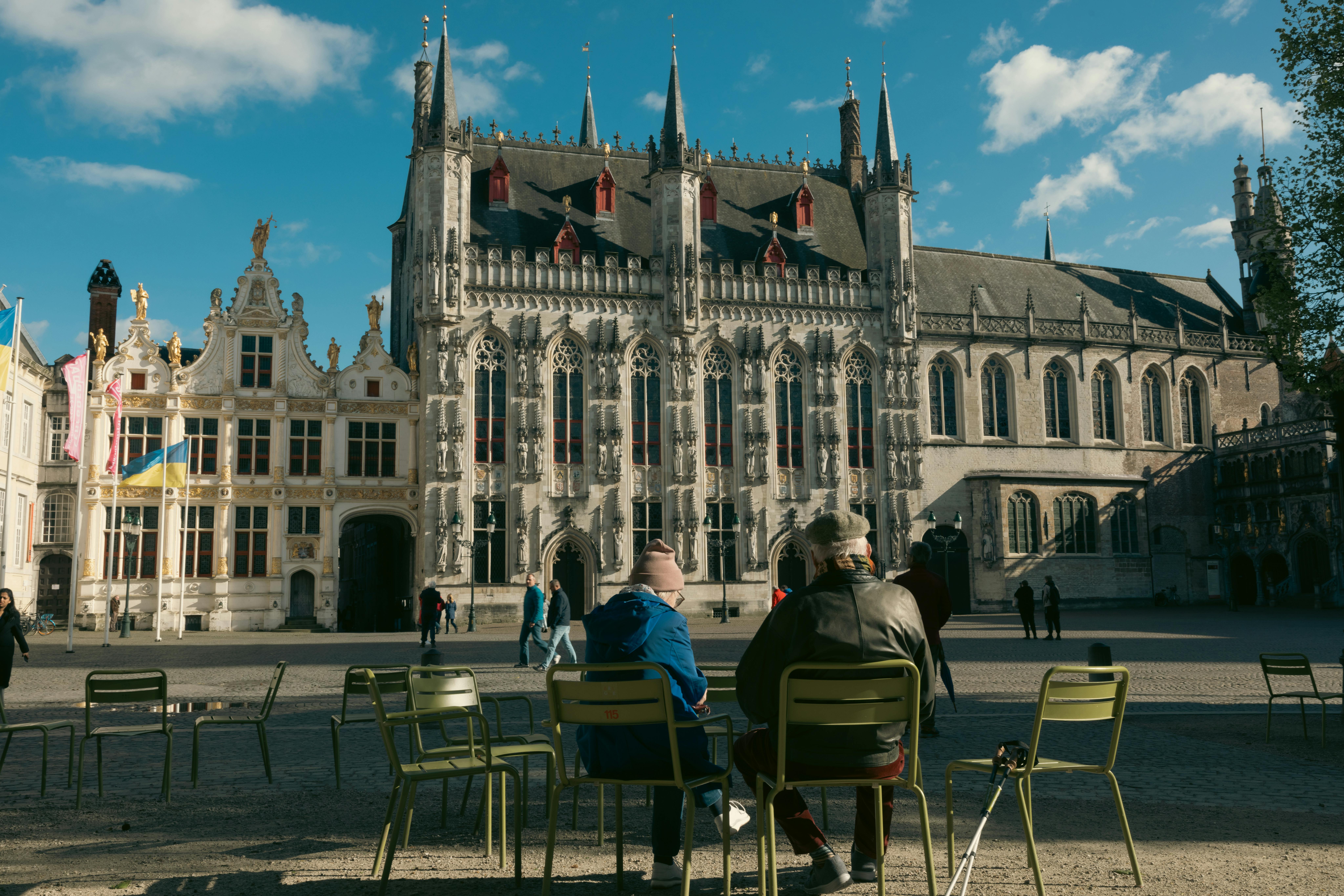 People Sitting on Square at De Burg Building in Bruges in Belgium ...