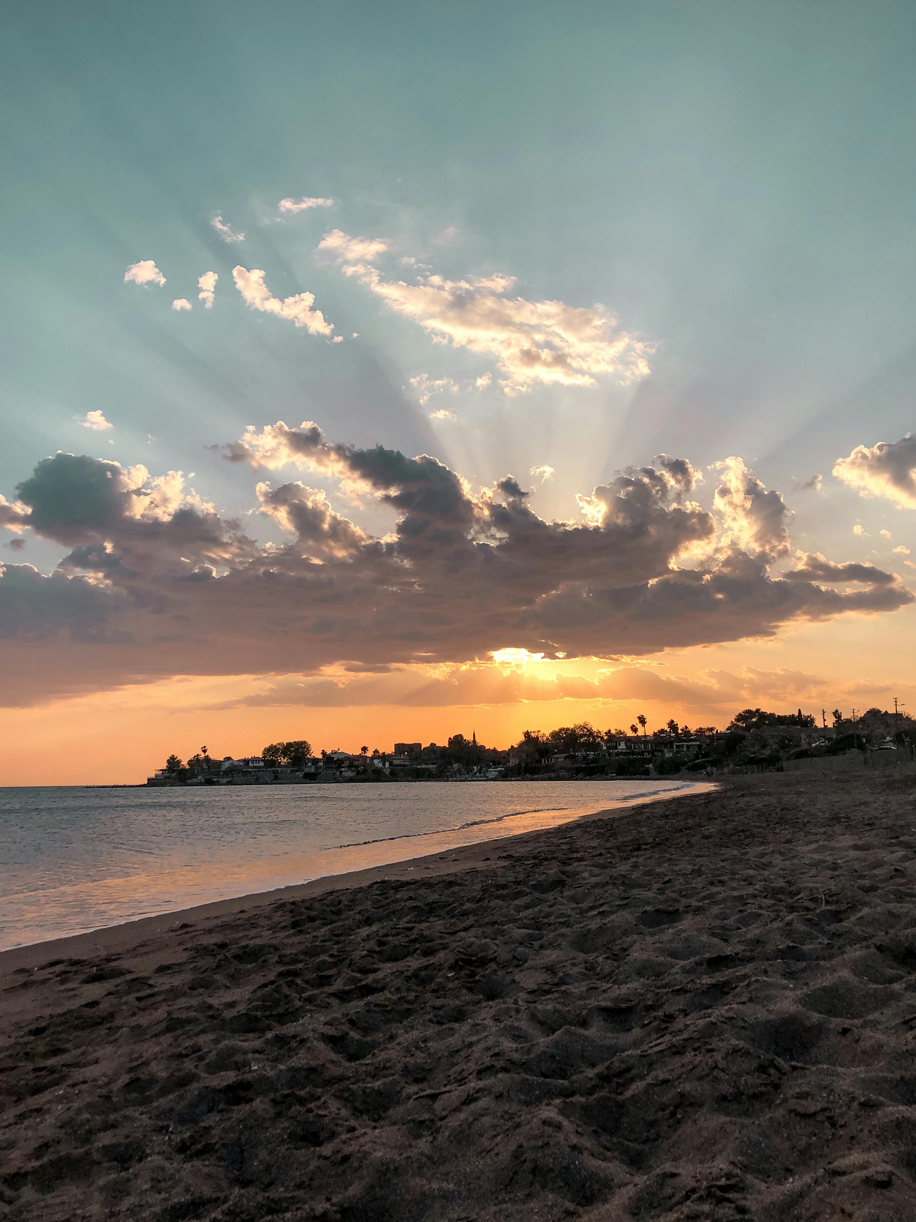 Seashore During Sunset · Free Stock Photo