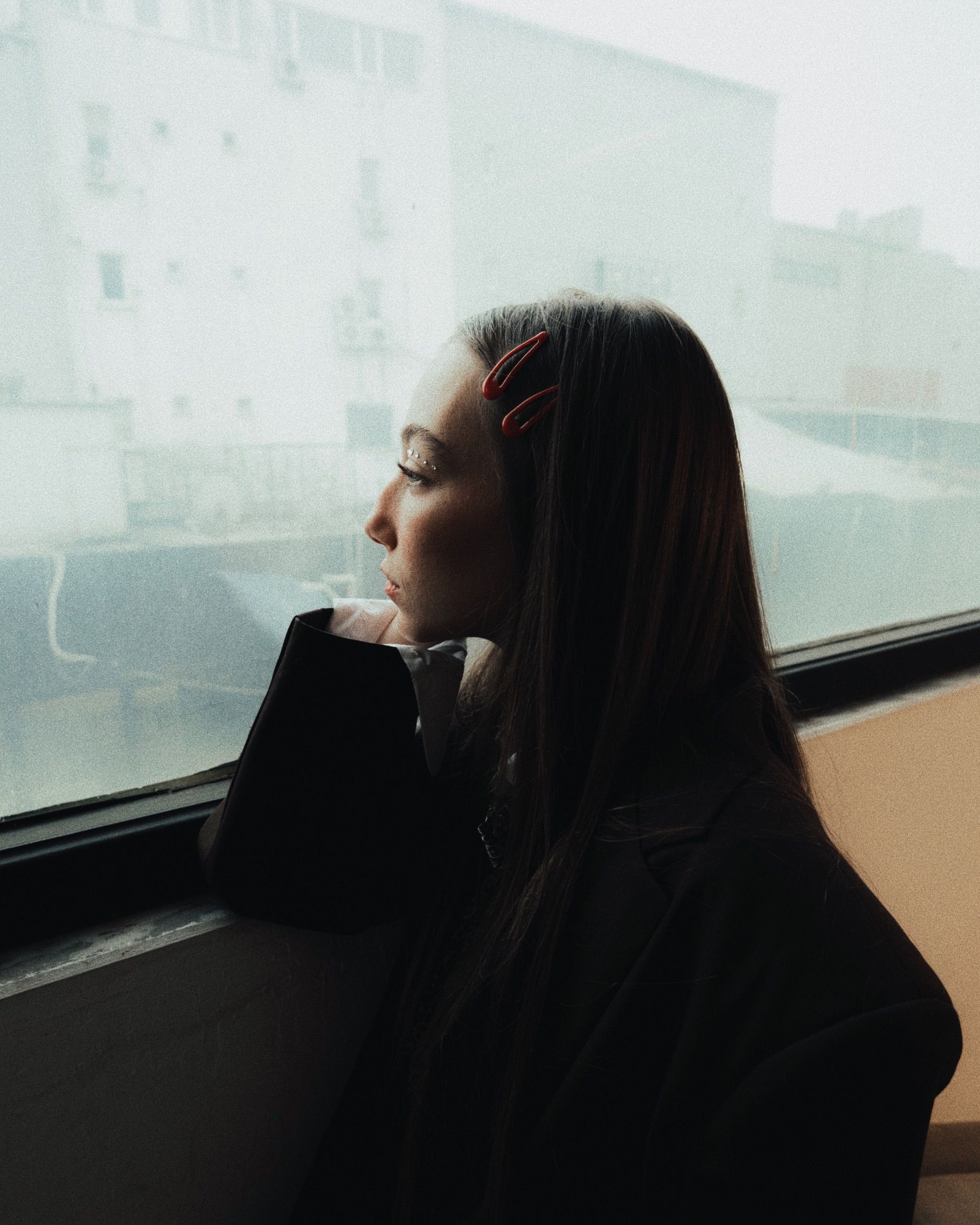 Woman Leaning on Glass Window · Free Stock Photo
