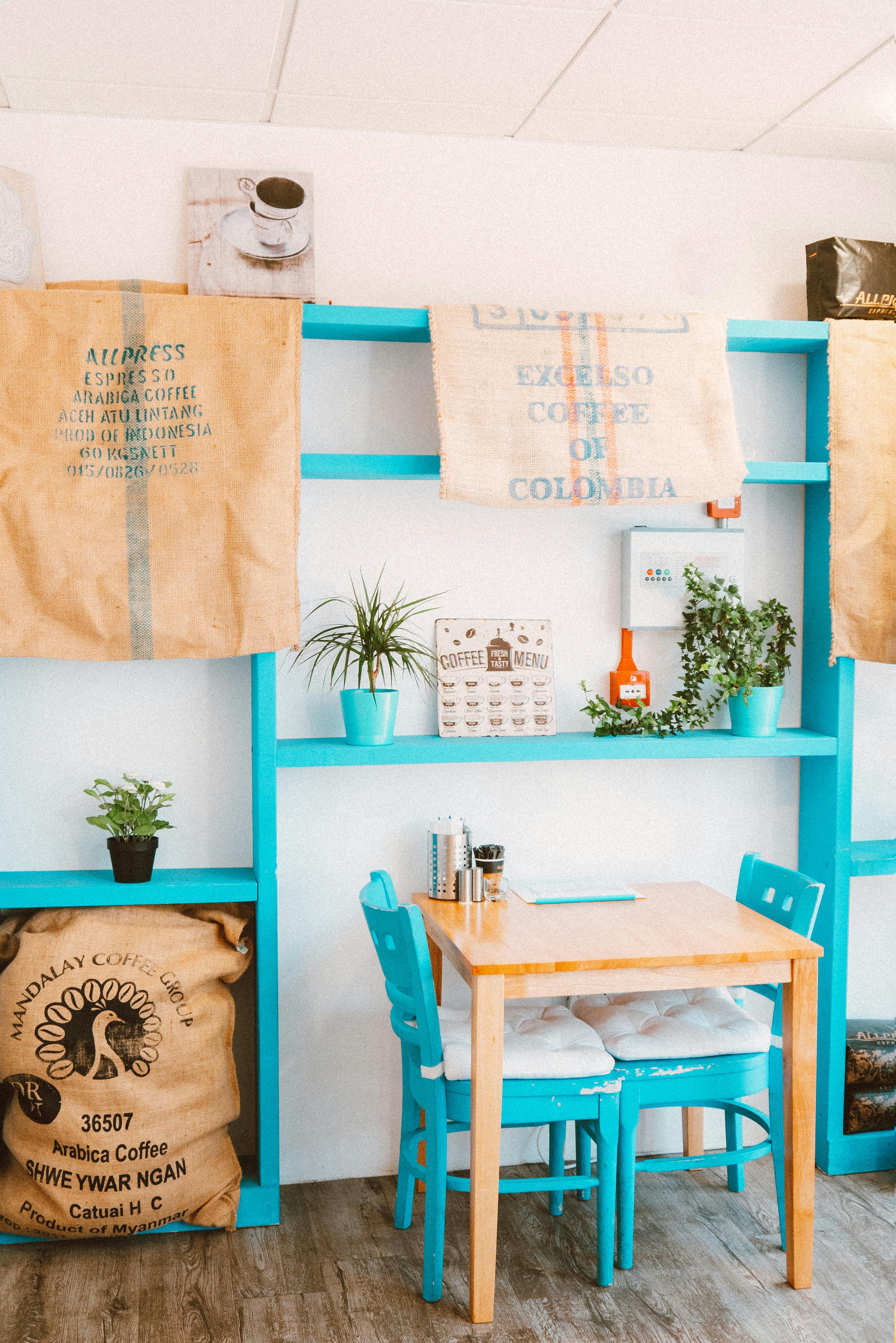 Brown Wooden Table and Chairs Inside Building · Free Stock Photo