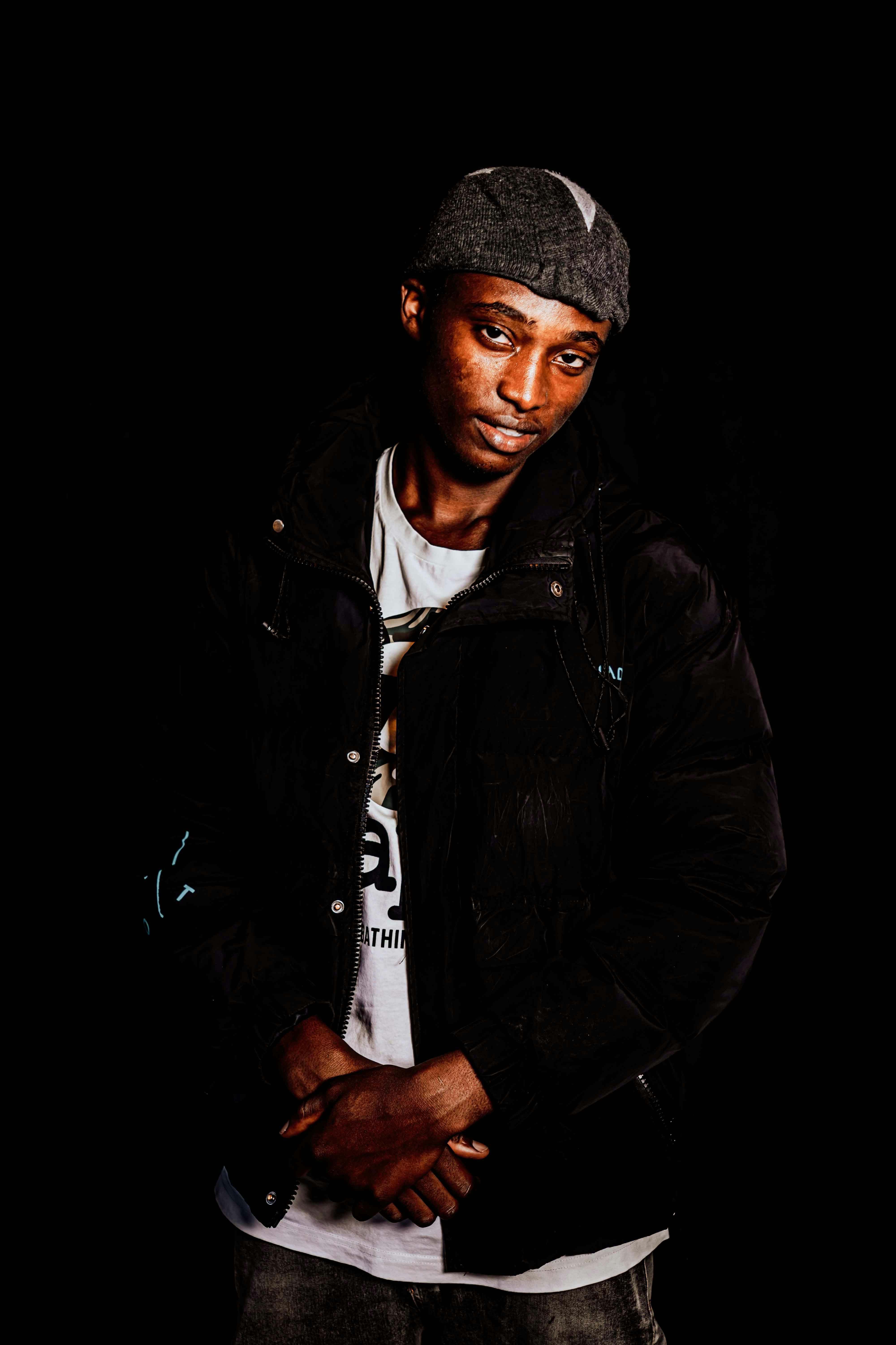 Male Model Wearing a Flat Cap and a Black Jacket · Free Stock Photo