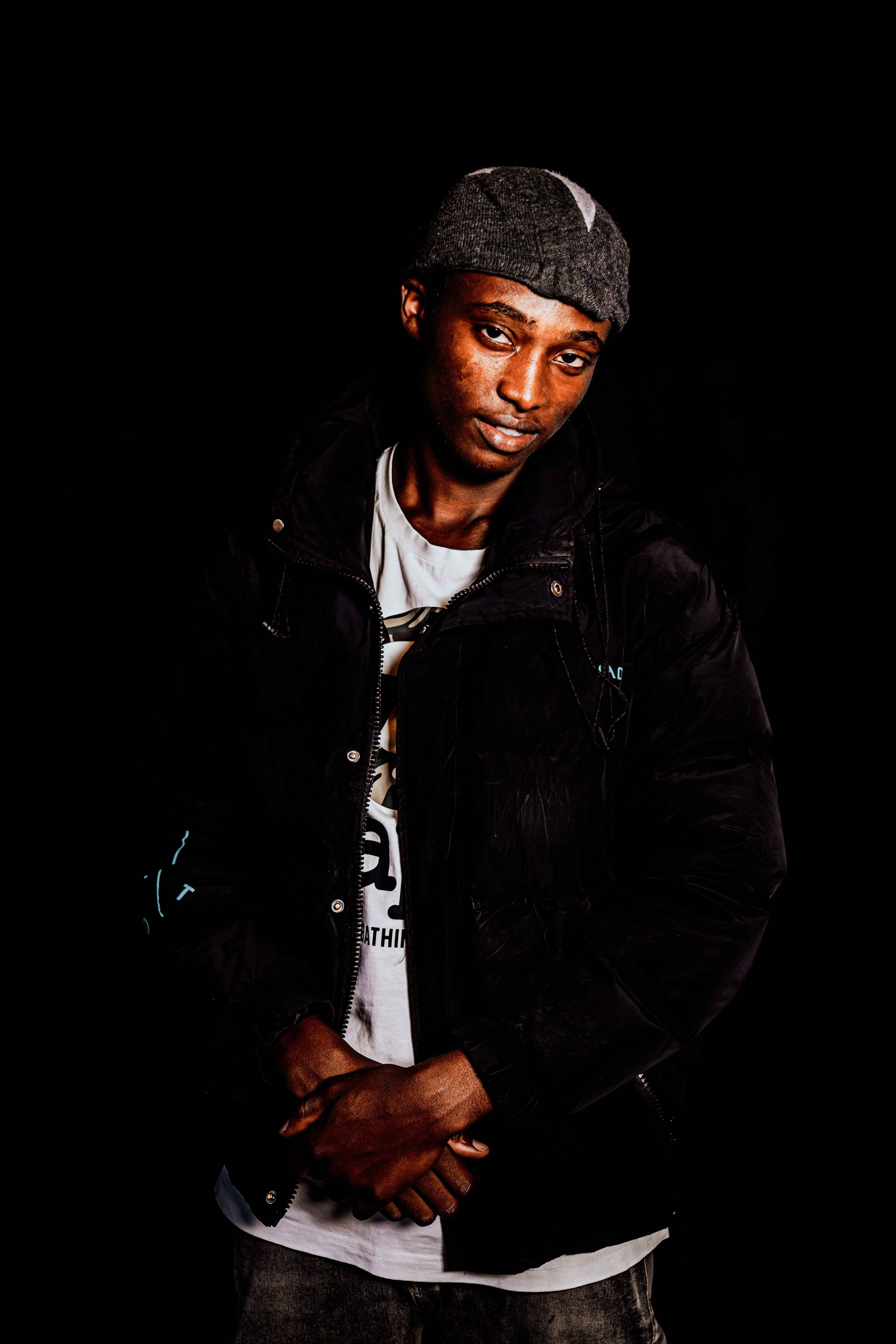 Male Model Wearing a Flat Cap and a Black Jacket · Free Stock Photo
