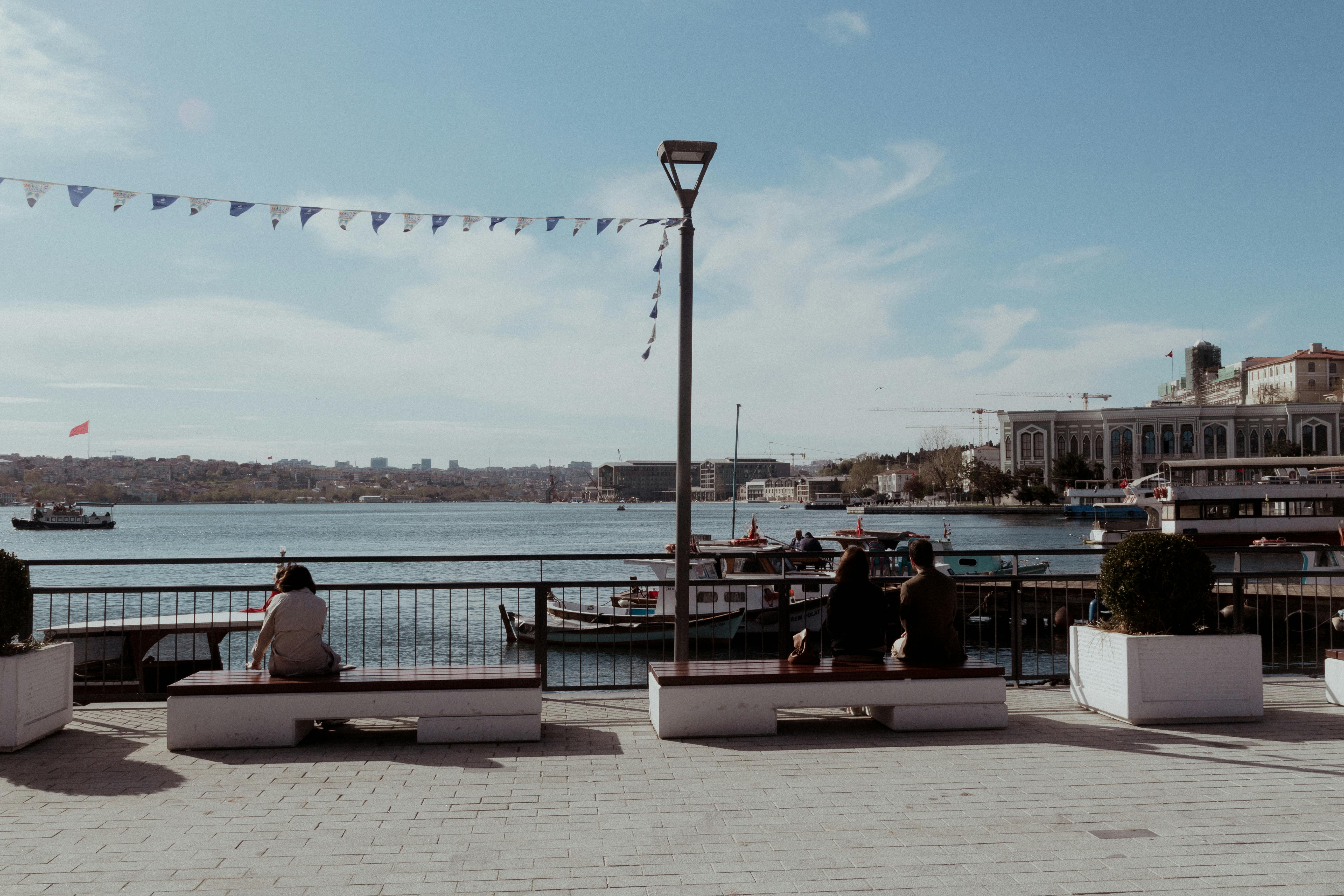 People on a Waterfront · Free Stock Photo