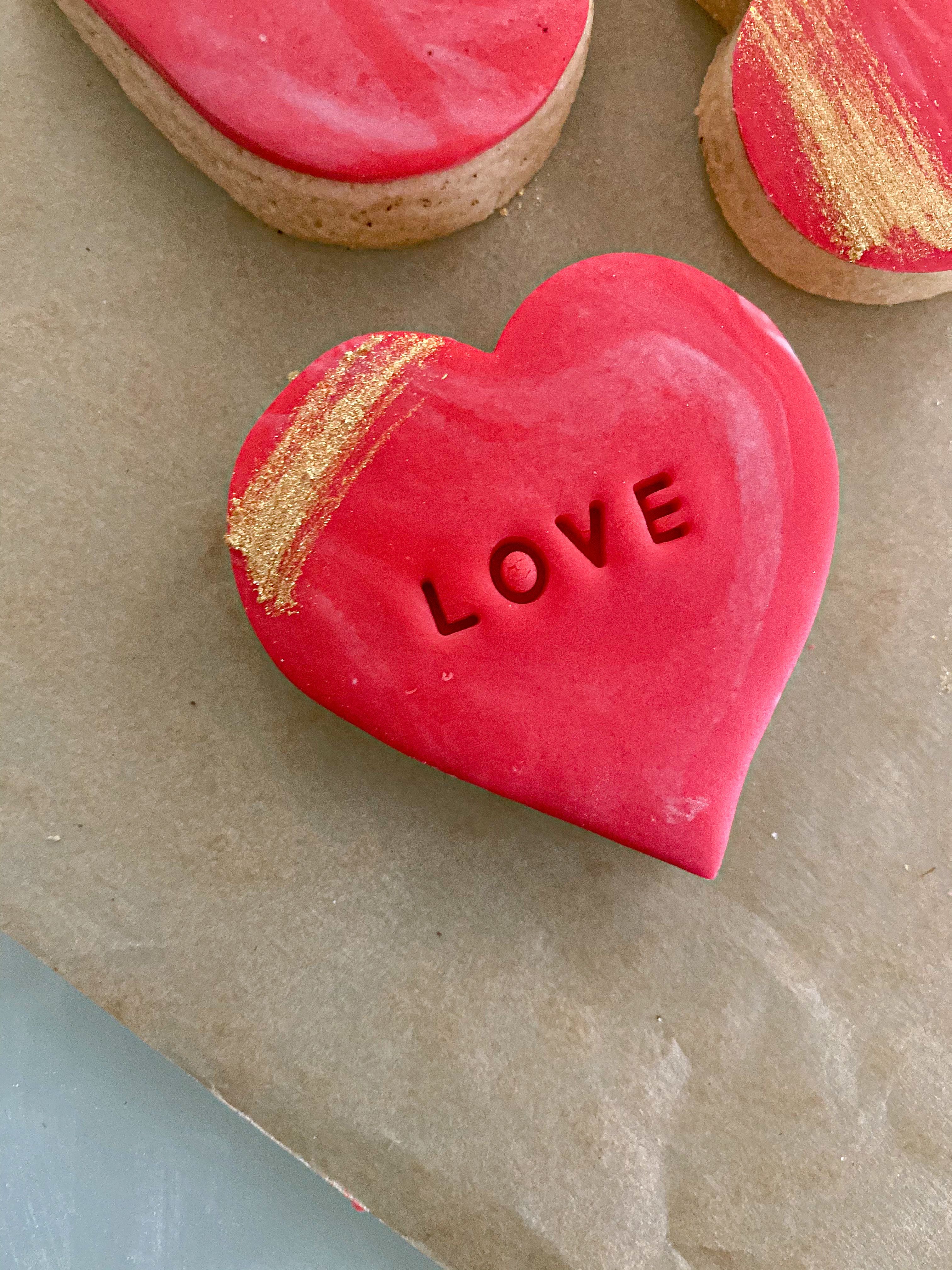 Arrangement of letter and heart shaped cookies · Free Stock Photo