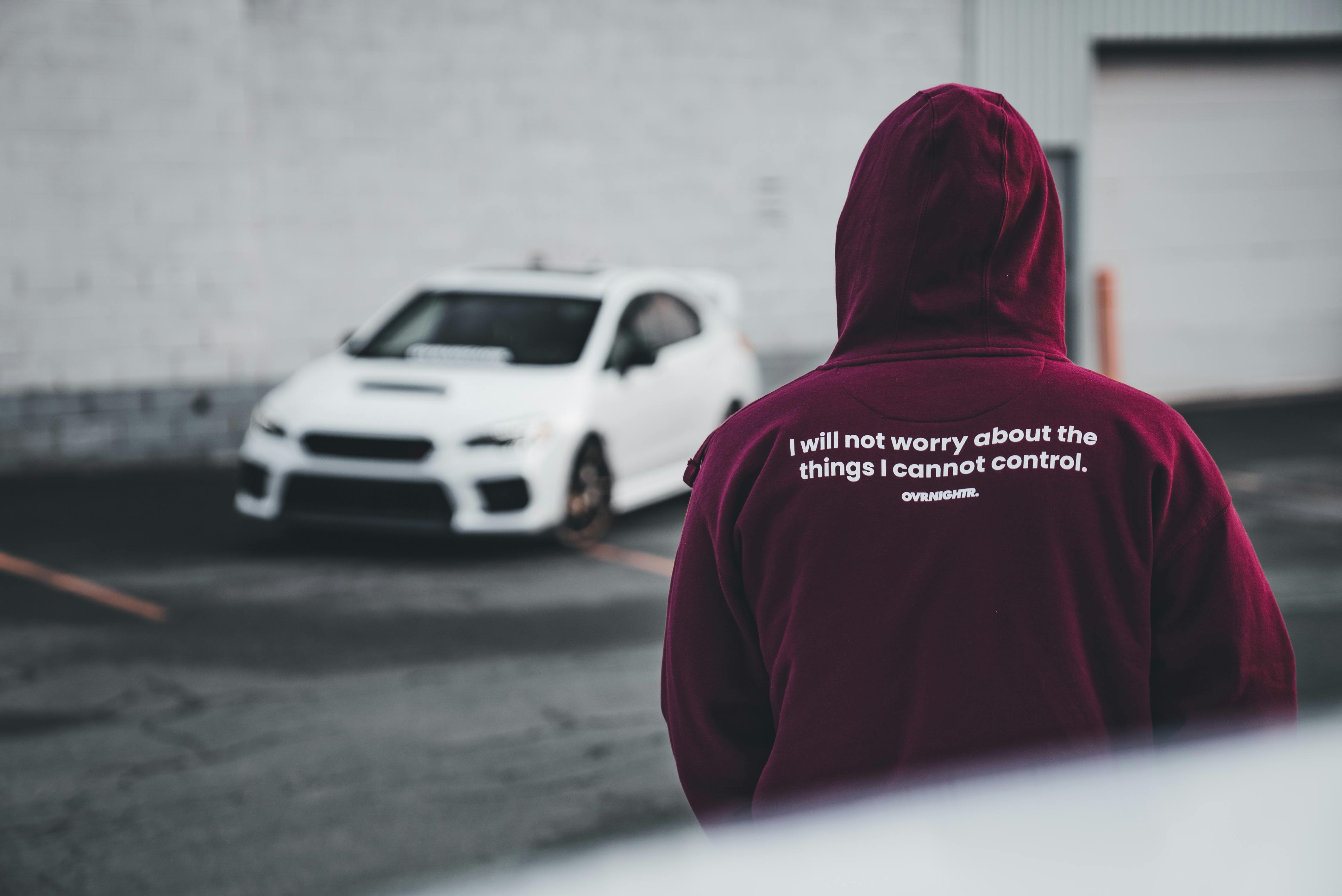 Person in Hoodie with Subaru WRX behind · Free Stock Photo