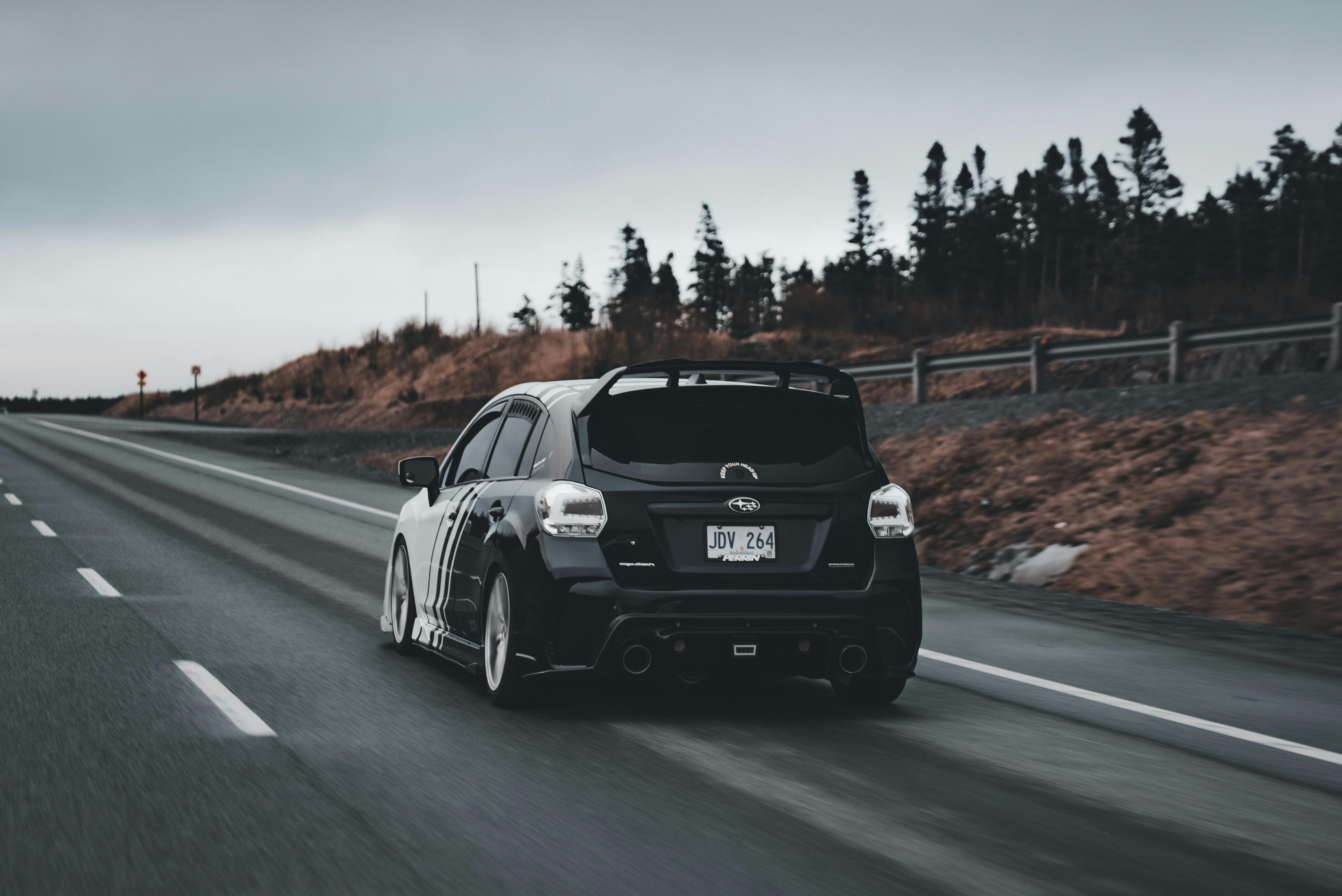Back View of Black Subaru WRX on Road · Free Stock Photo