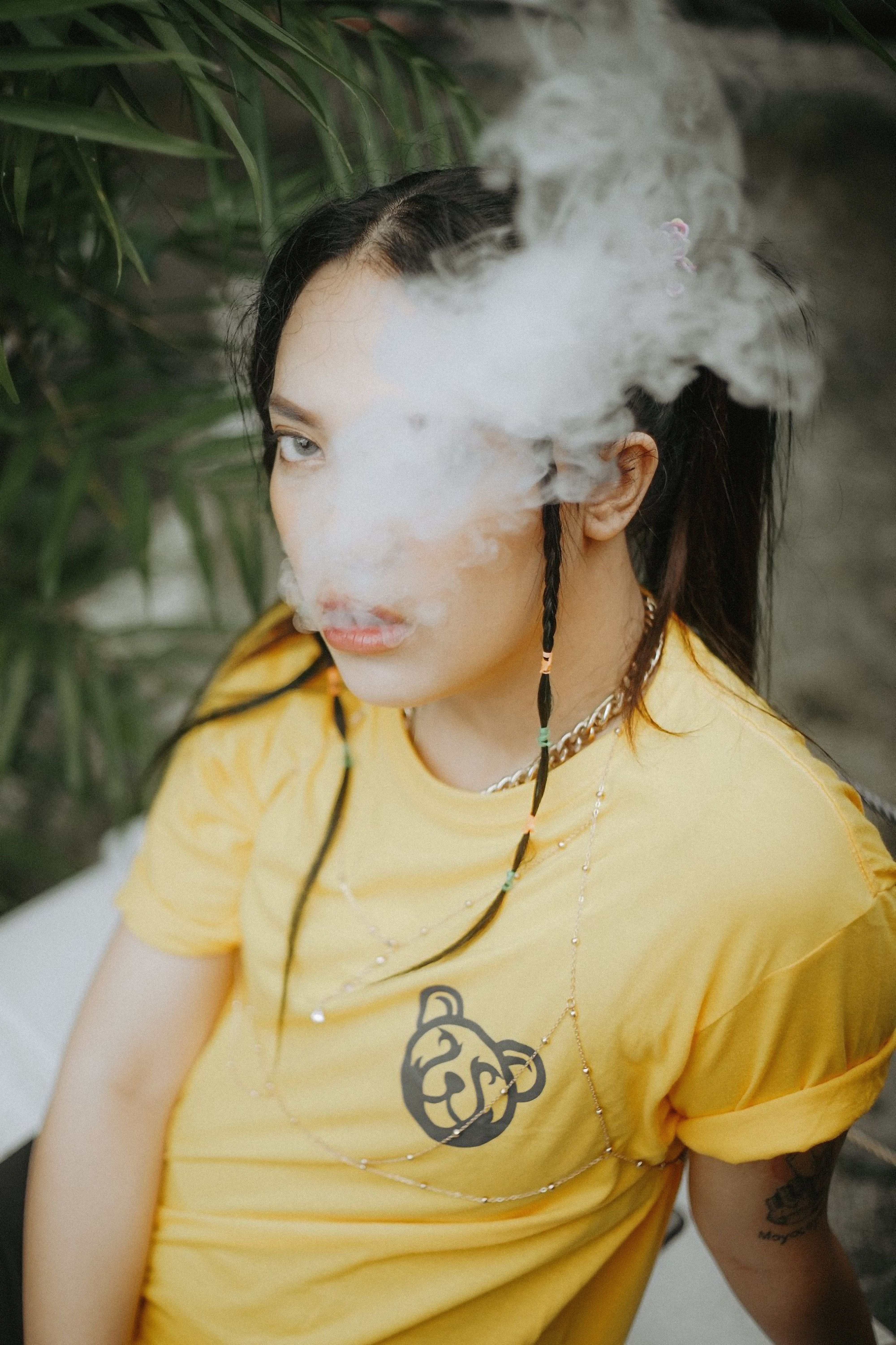 Portrait of Woman Sitting and Smoking · Free Stock Photo