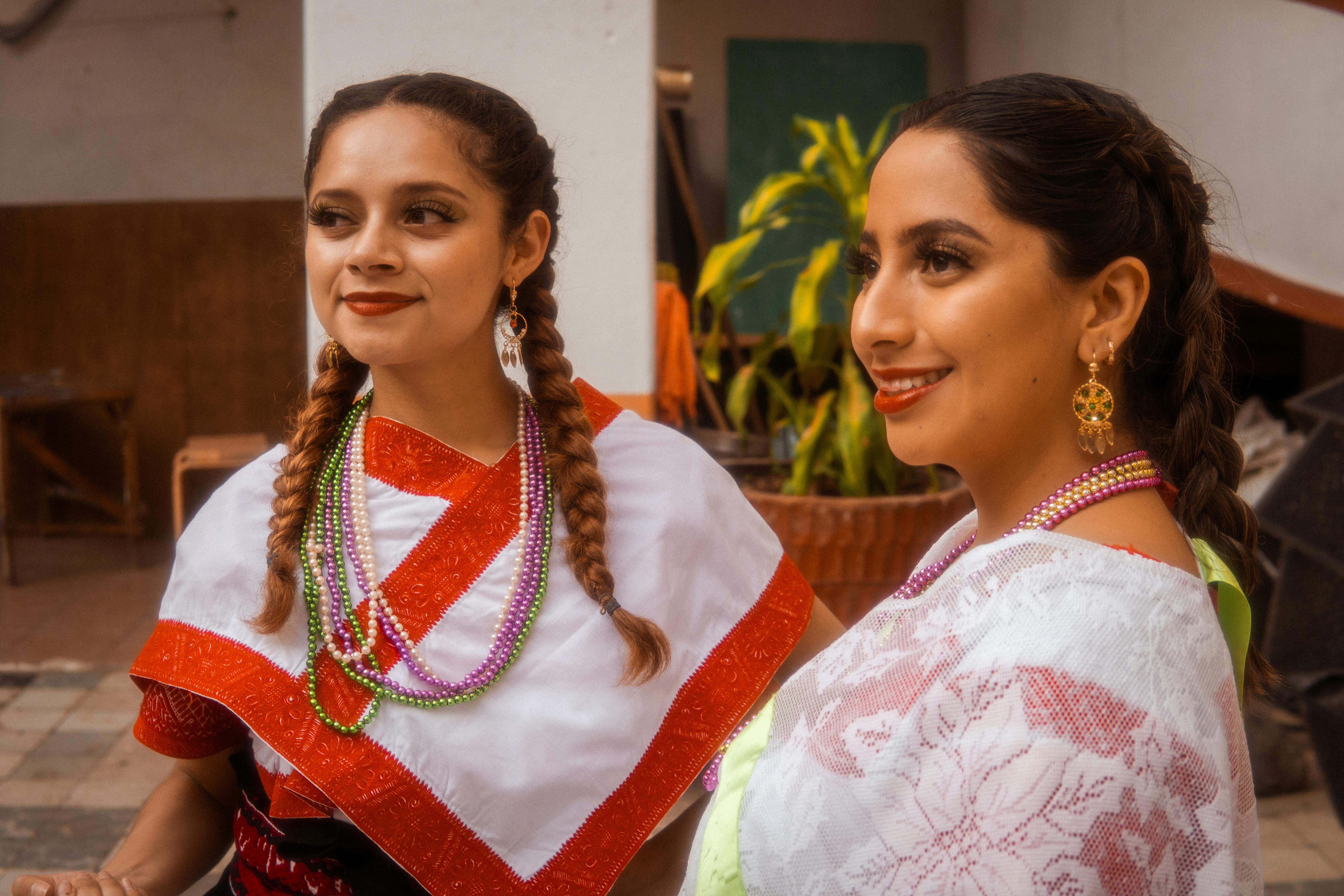 Photo of Two Women Wearing Traditional Clothing · Free Stock Photo