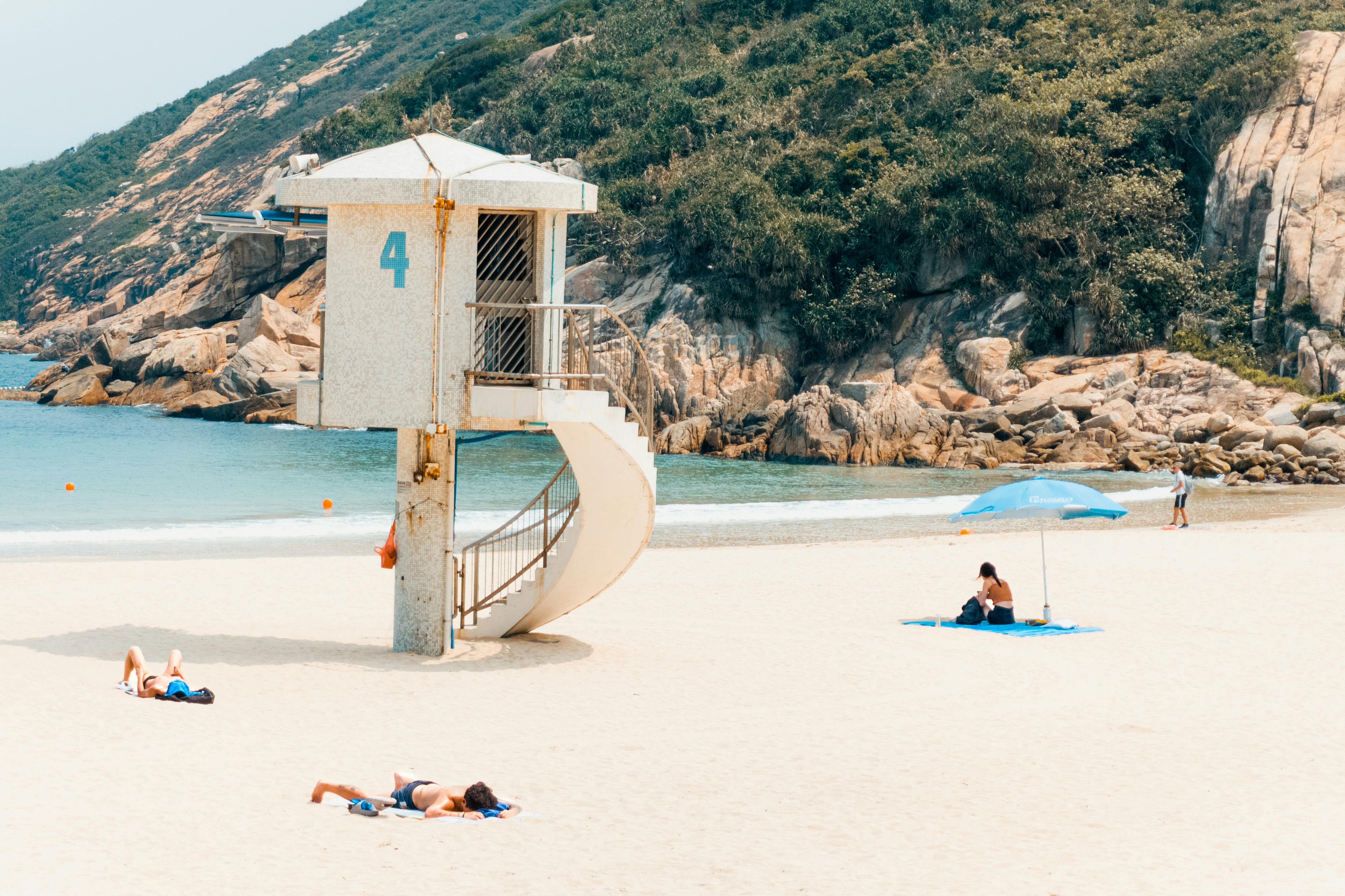 People Sunbathing near the Lifeguards Hut on Shek O Beach in Hong Kong ...